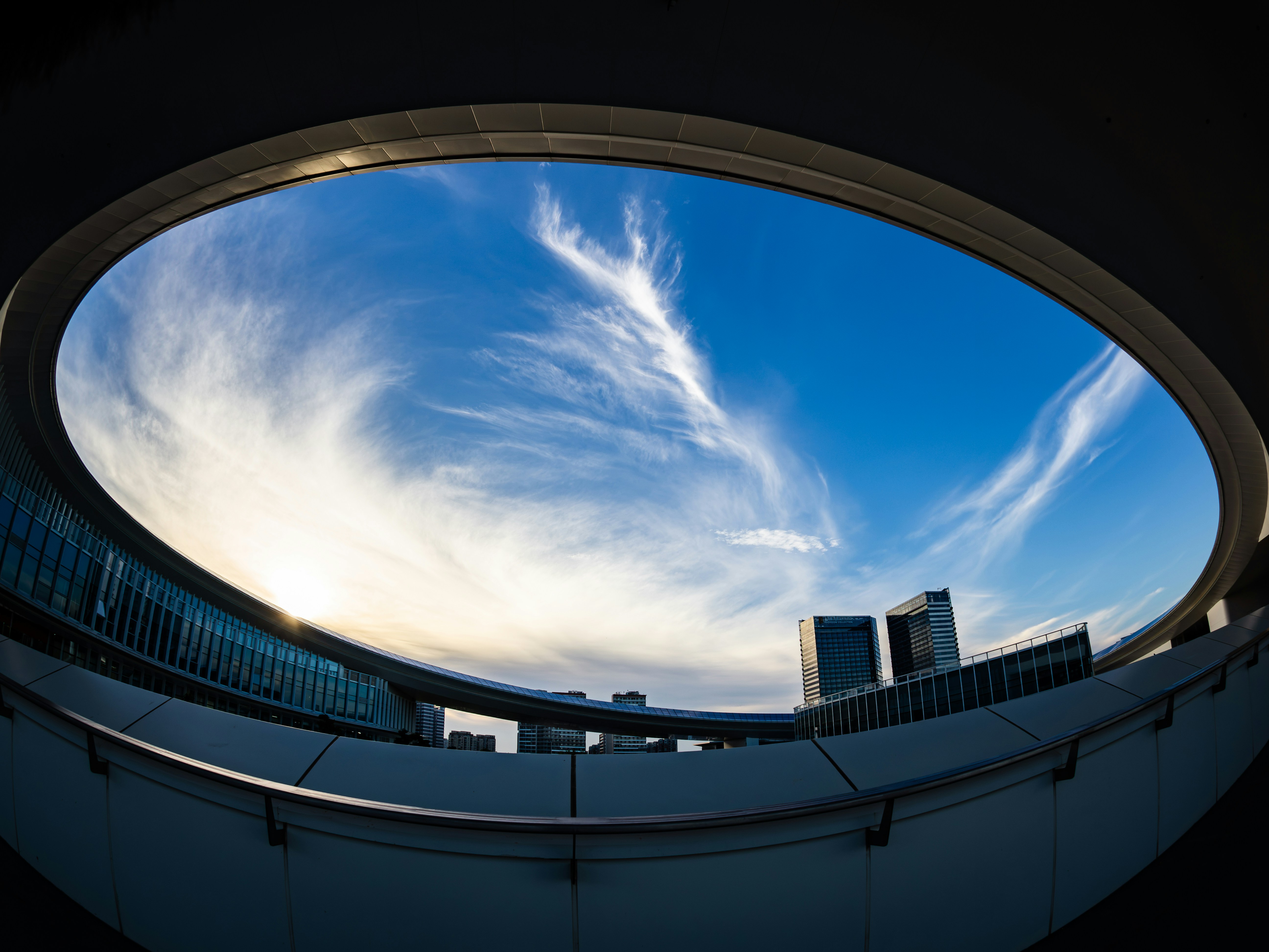 Circular Vistas: City Skyline Framed by an Oval Aperture