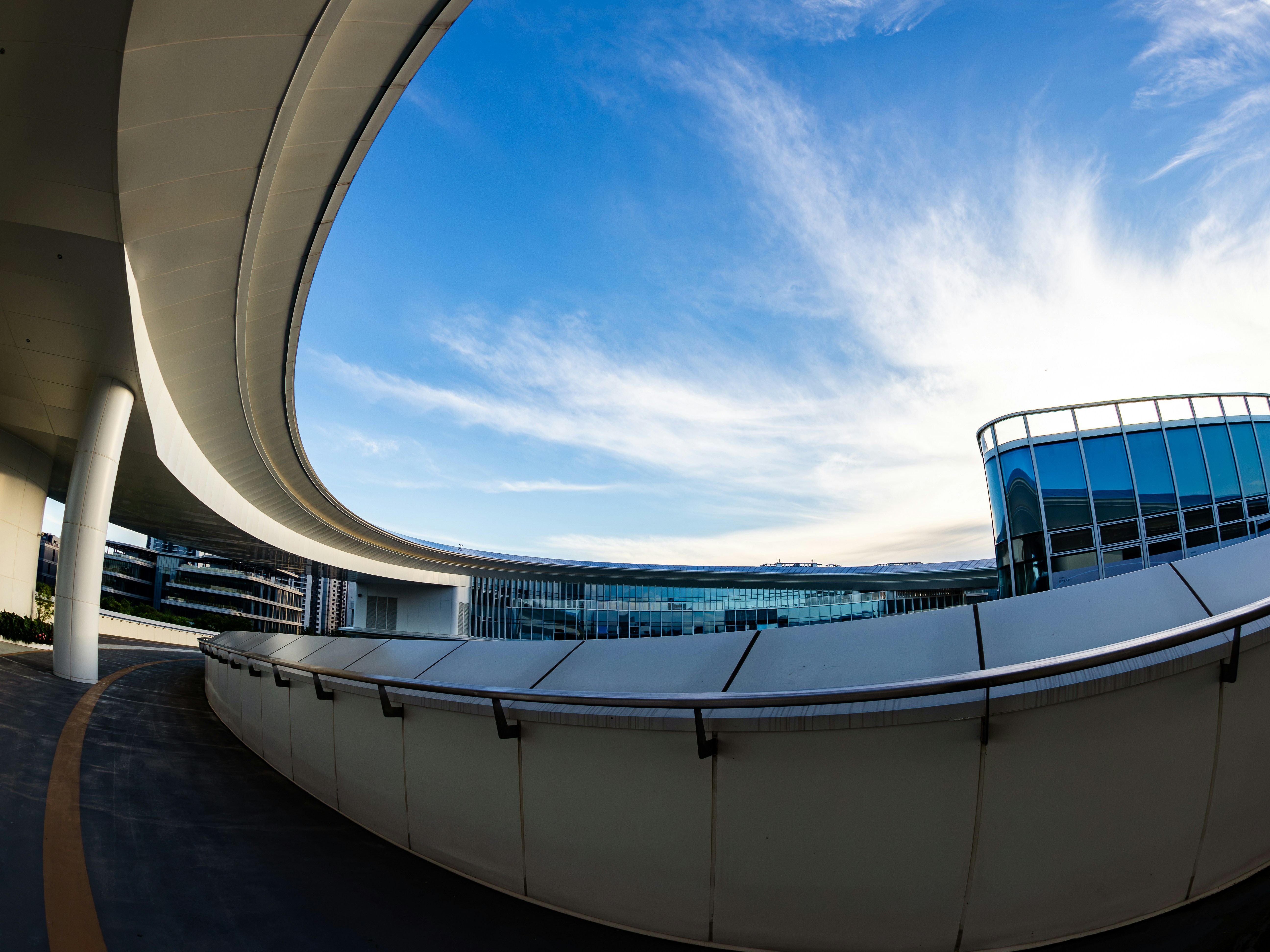 Circling Sky: A Curved Path Beneath a Glass Sky