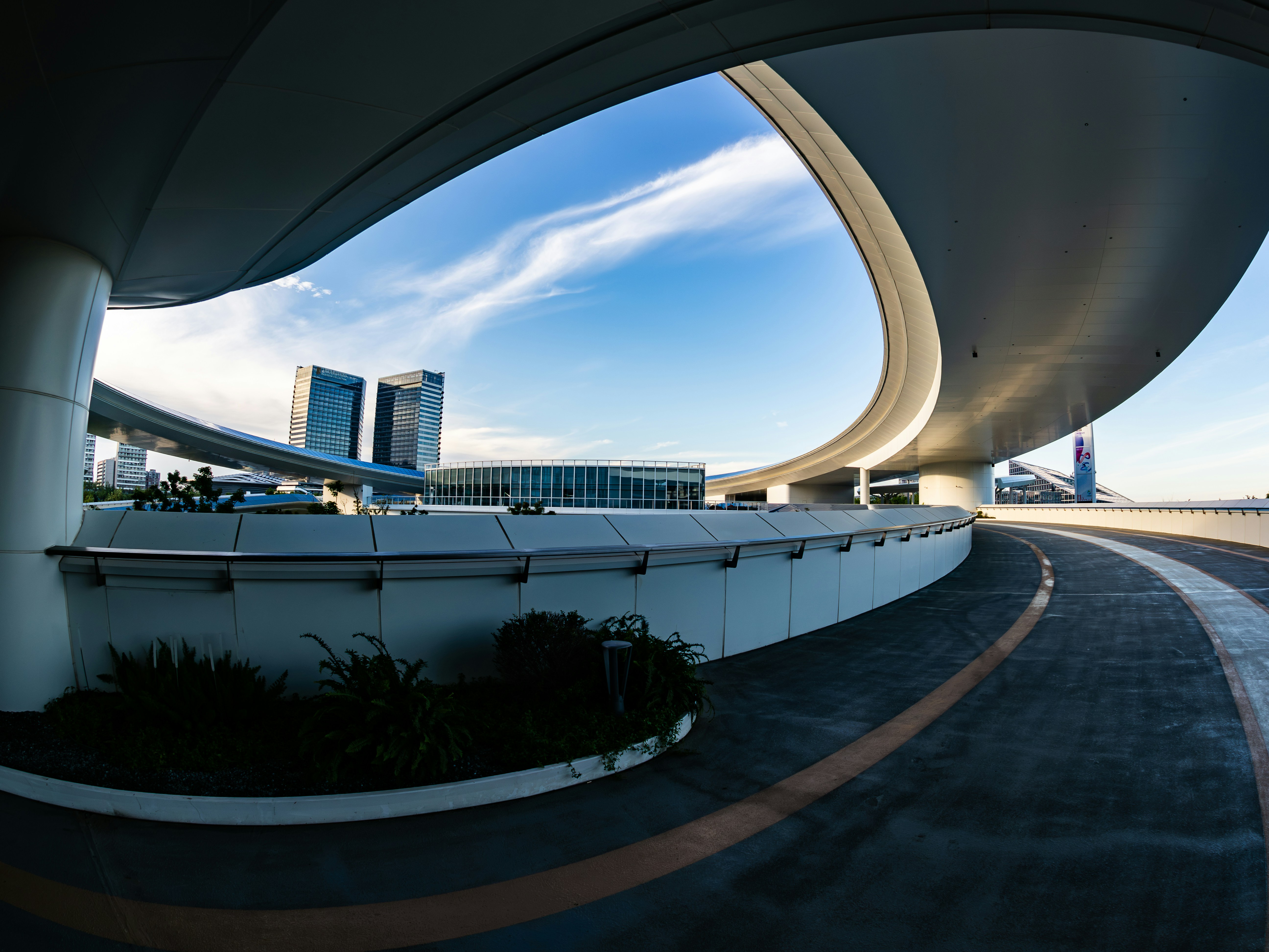 Curved Passage: Urban Architecture Under the Blue Sky