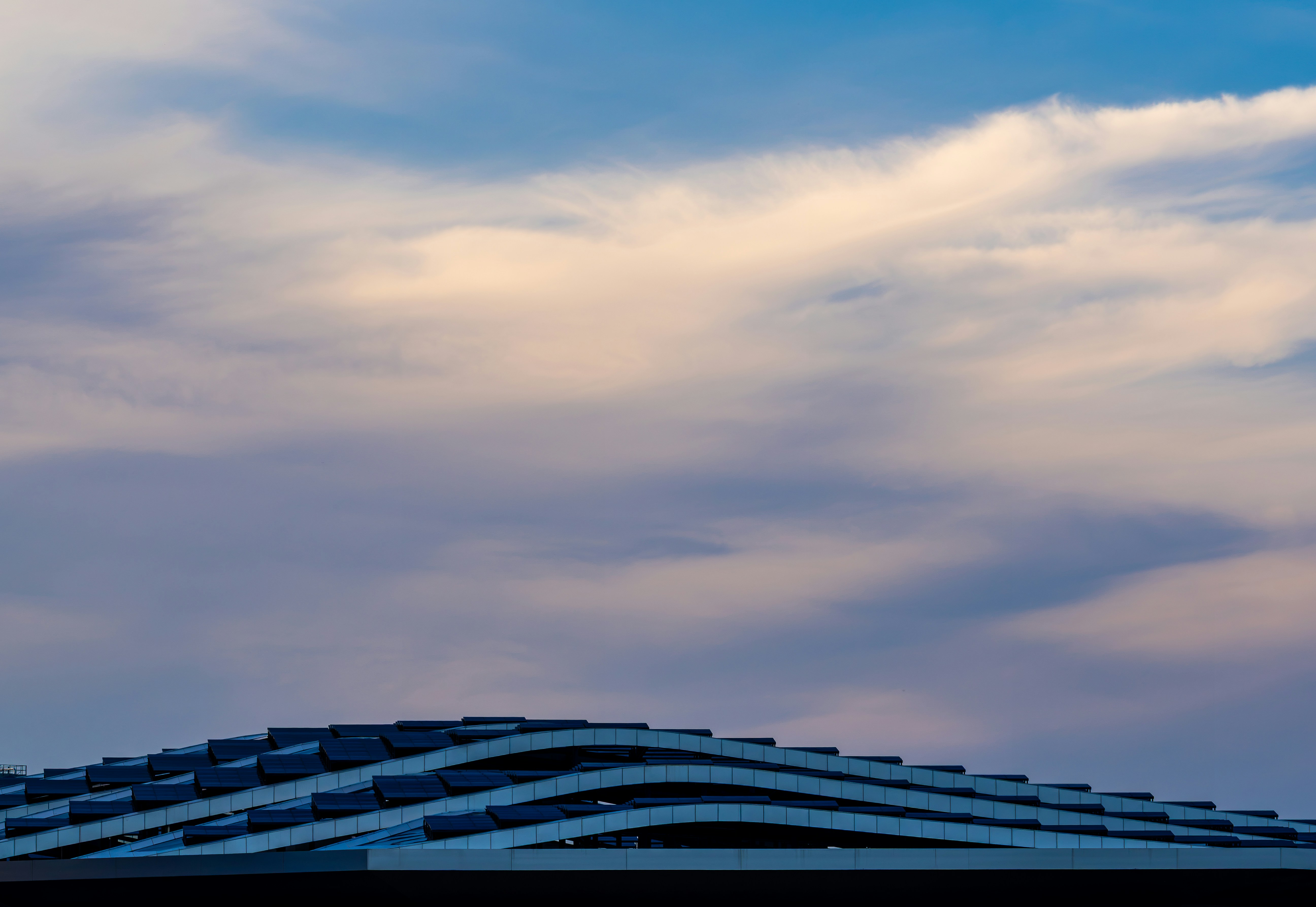 Woven Rooftops Under Distant Sky