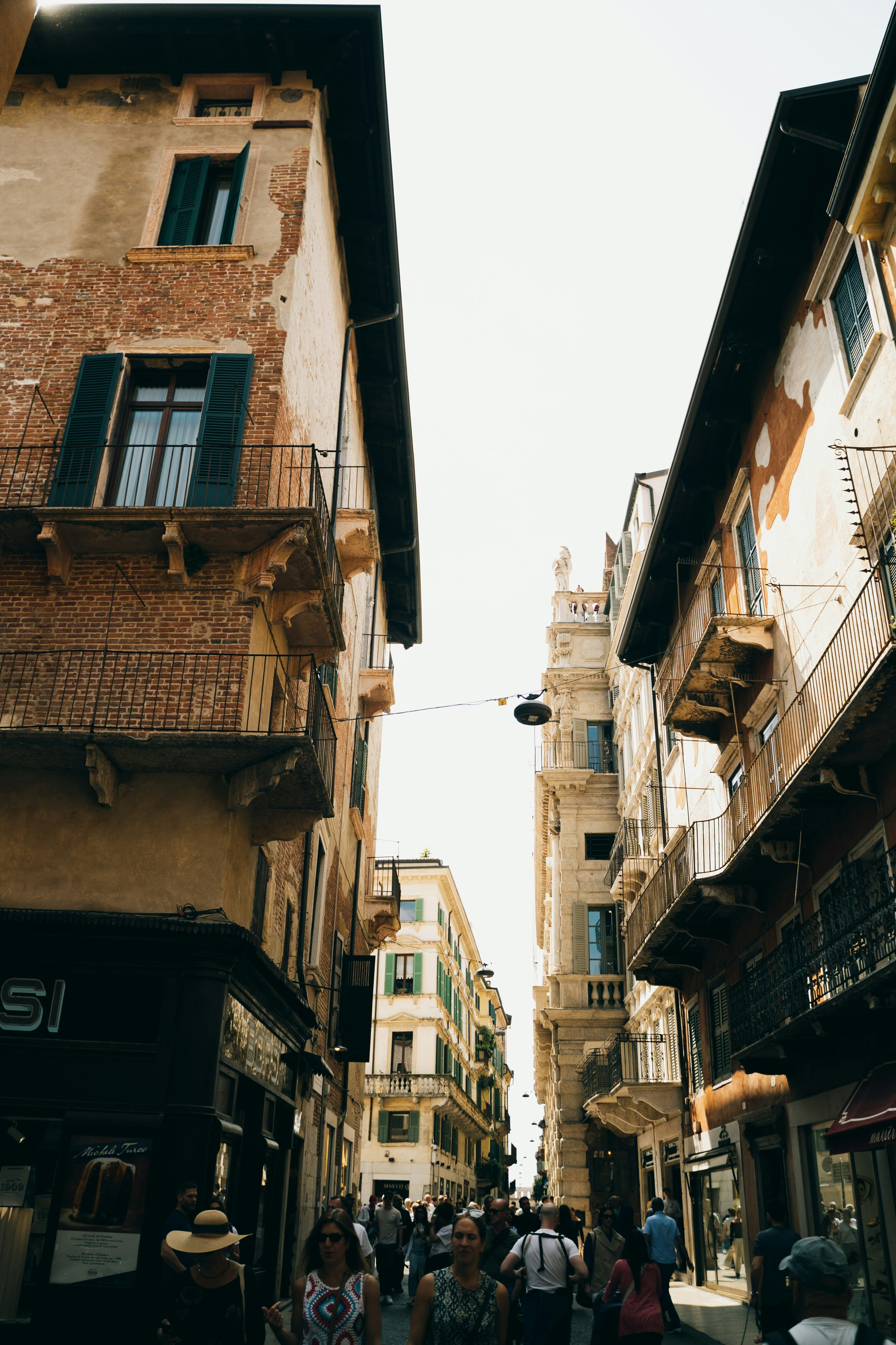 Cobblestone Street Pulse: A Sunset Walk Through a Daylight Alley