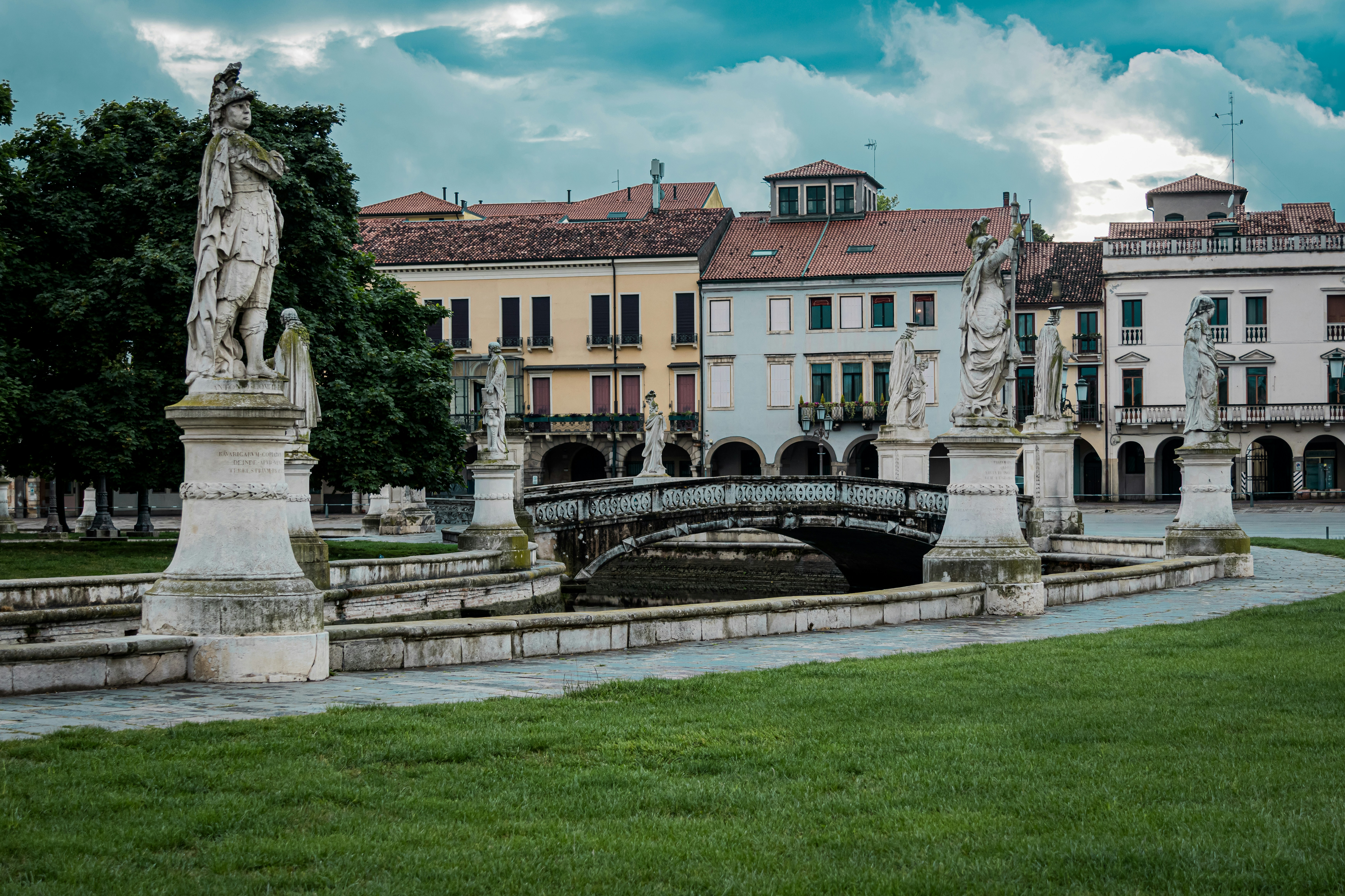 Statue-lined Bridge Over a Historic Italian-Style Plaza