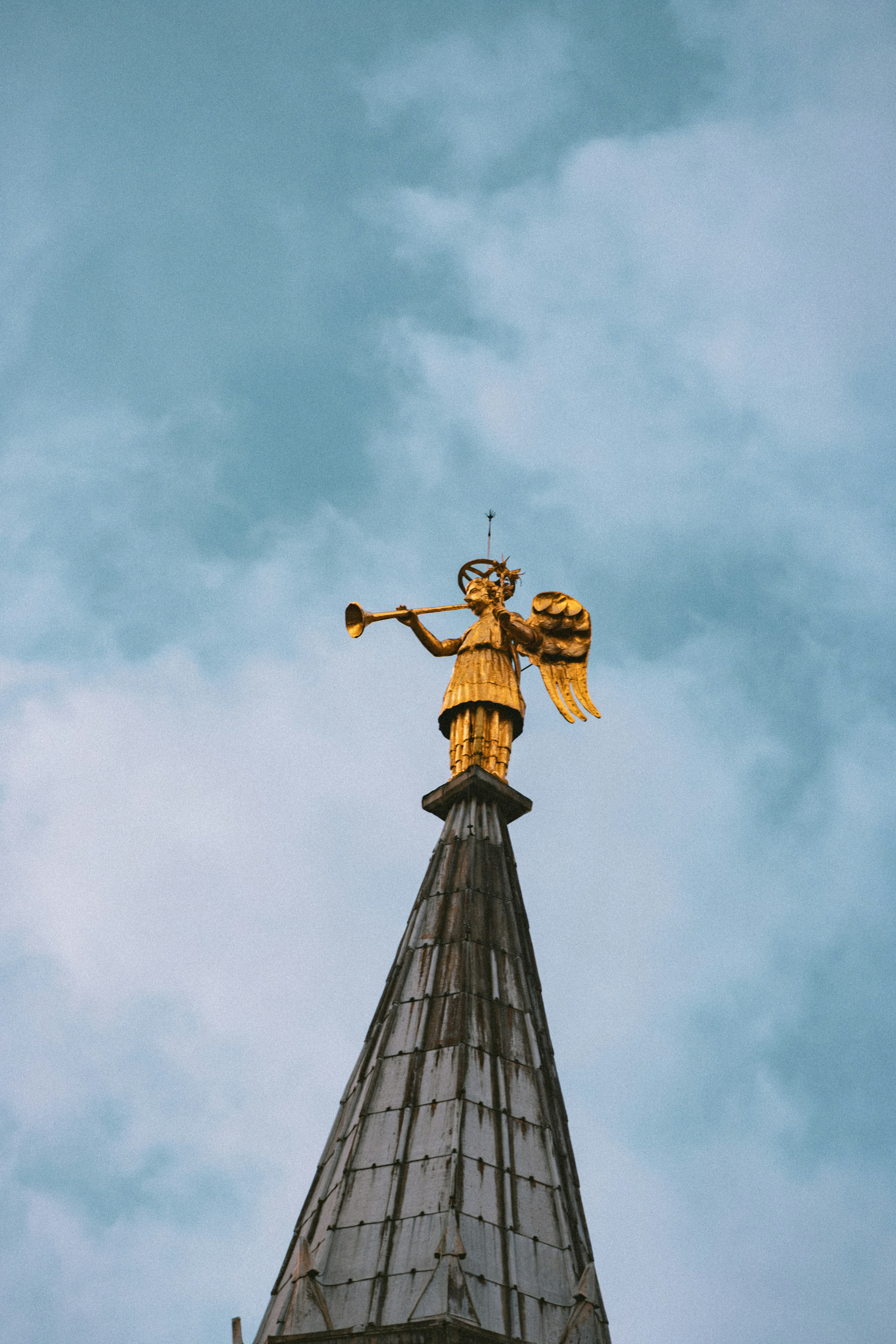 Golden Angel at the Apex: Horn, Wing and Spire