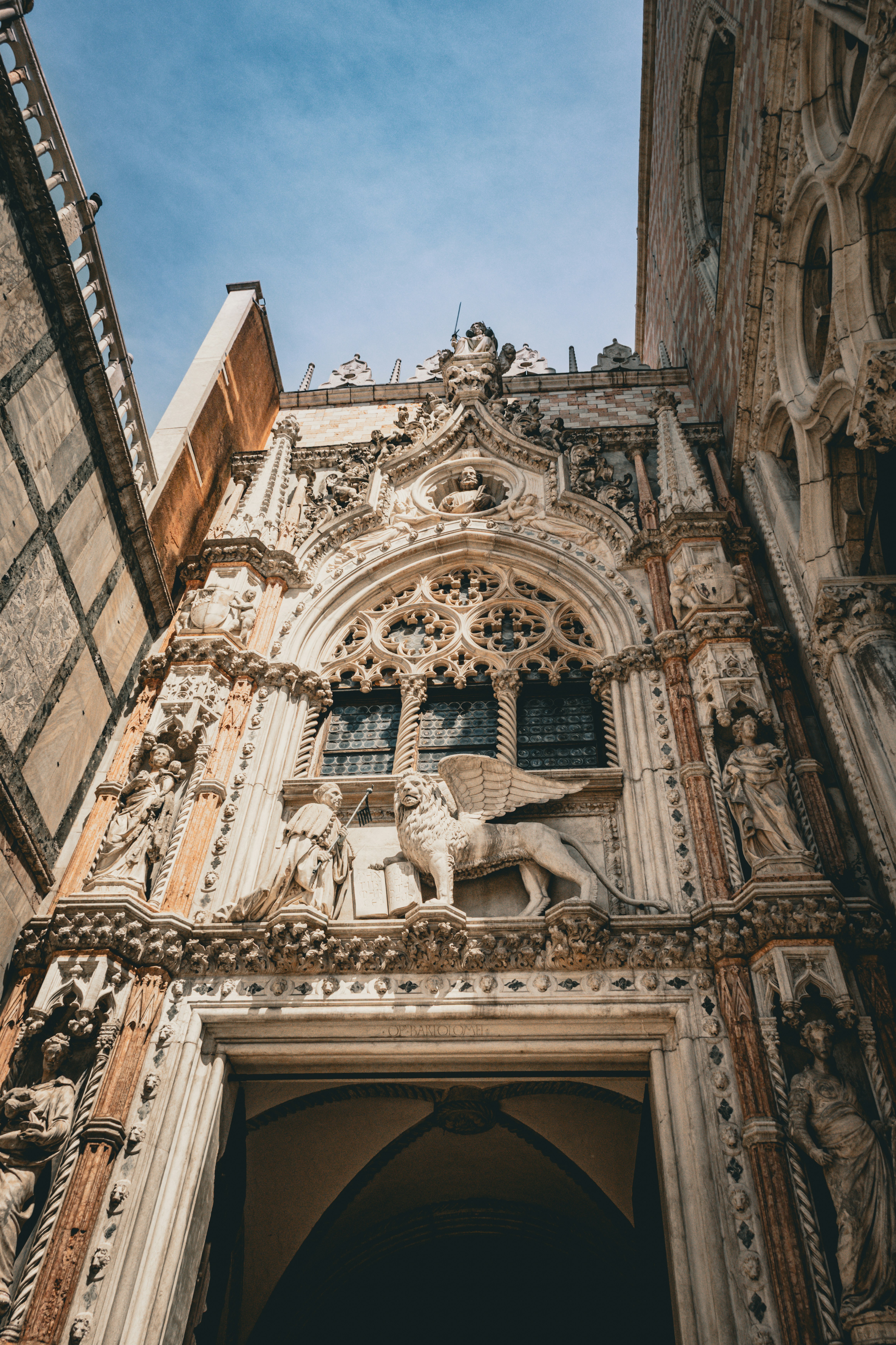 Gothic Portal in Statued Cathedral Façade Framed by Sky