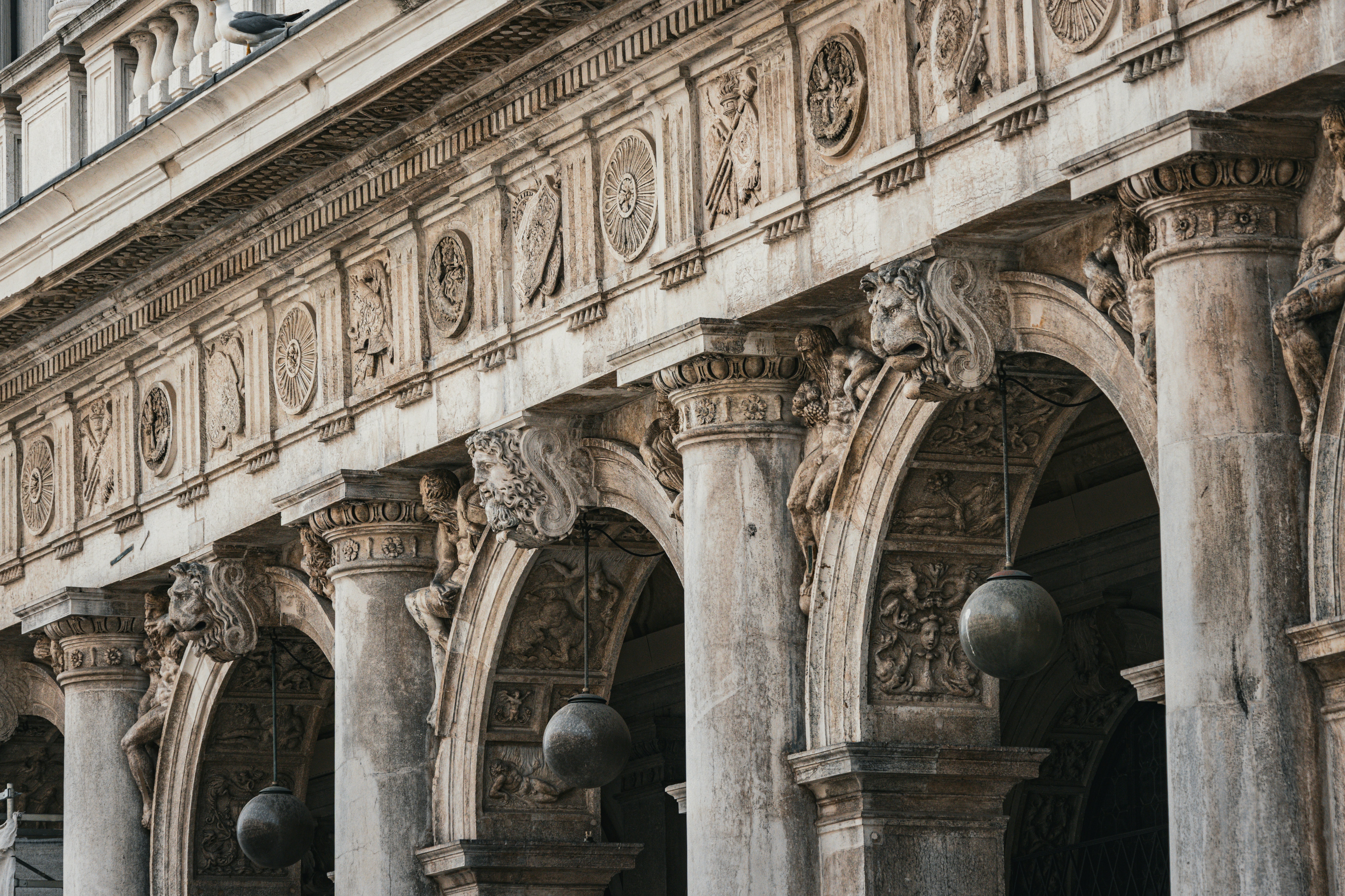 Stone Carved Arcades: Lions, Ornaments, and Arcade Portraits