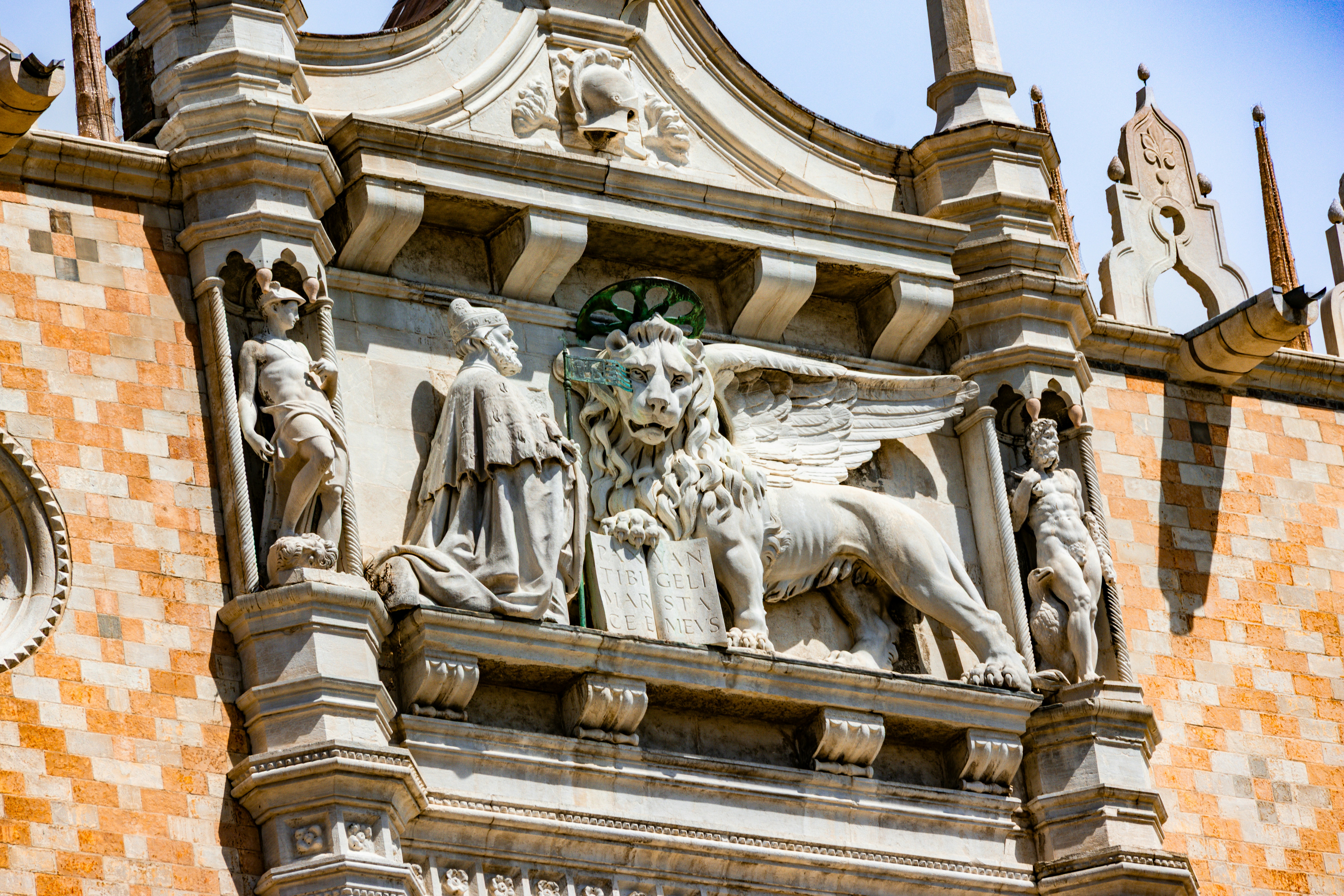 Winged guardian over a sunlit Renaissance façade