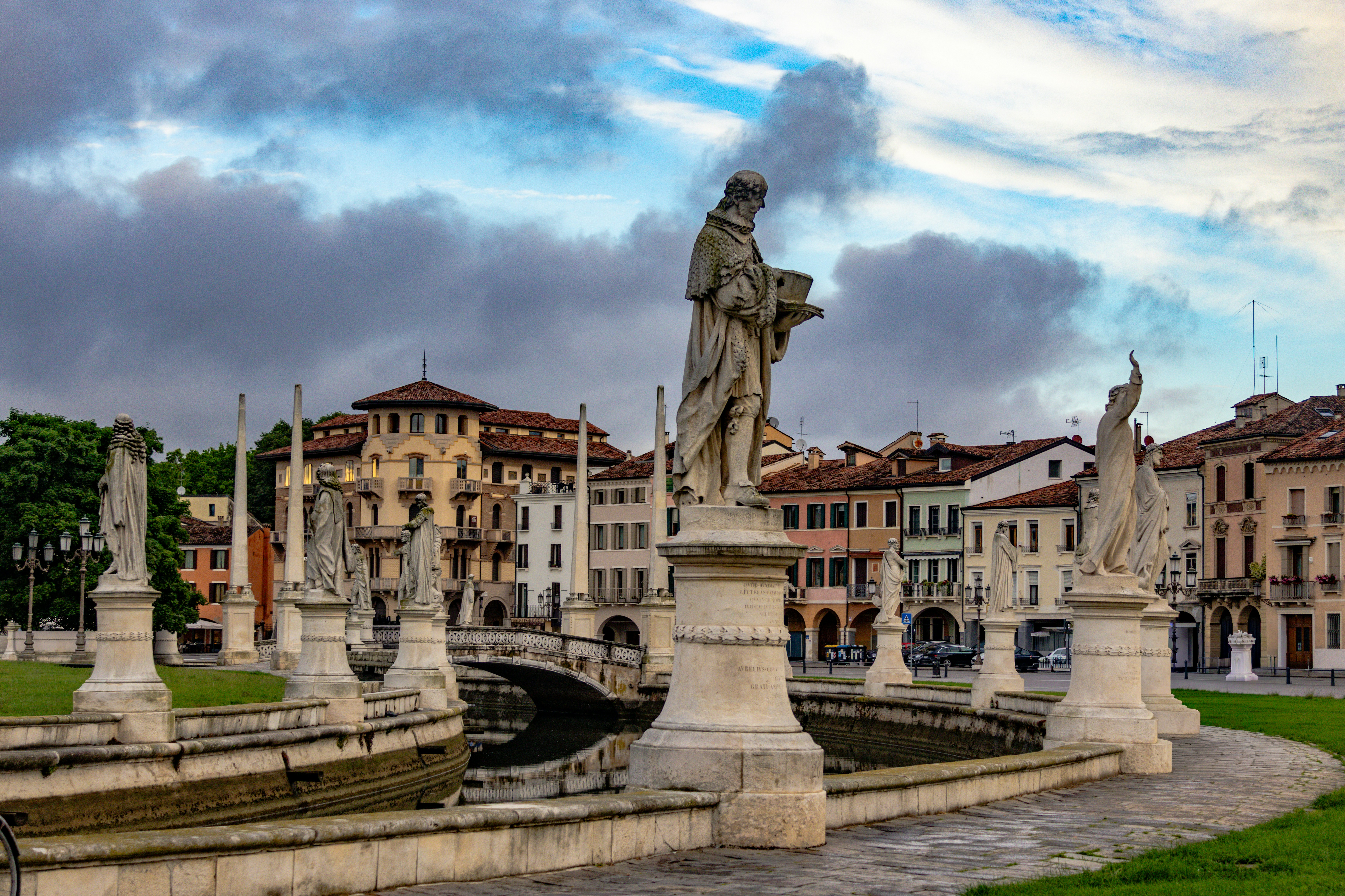 Statues Framing the Arched Bridge in a Italian Piazza