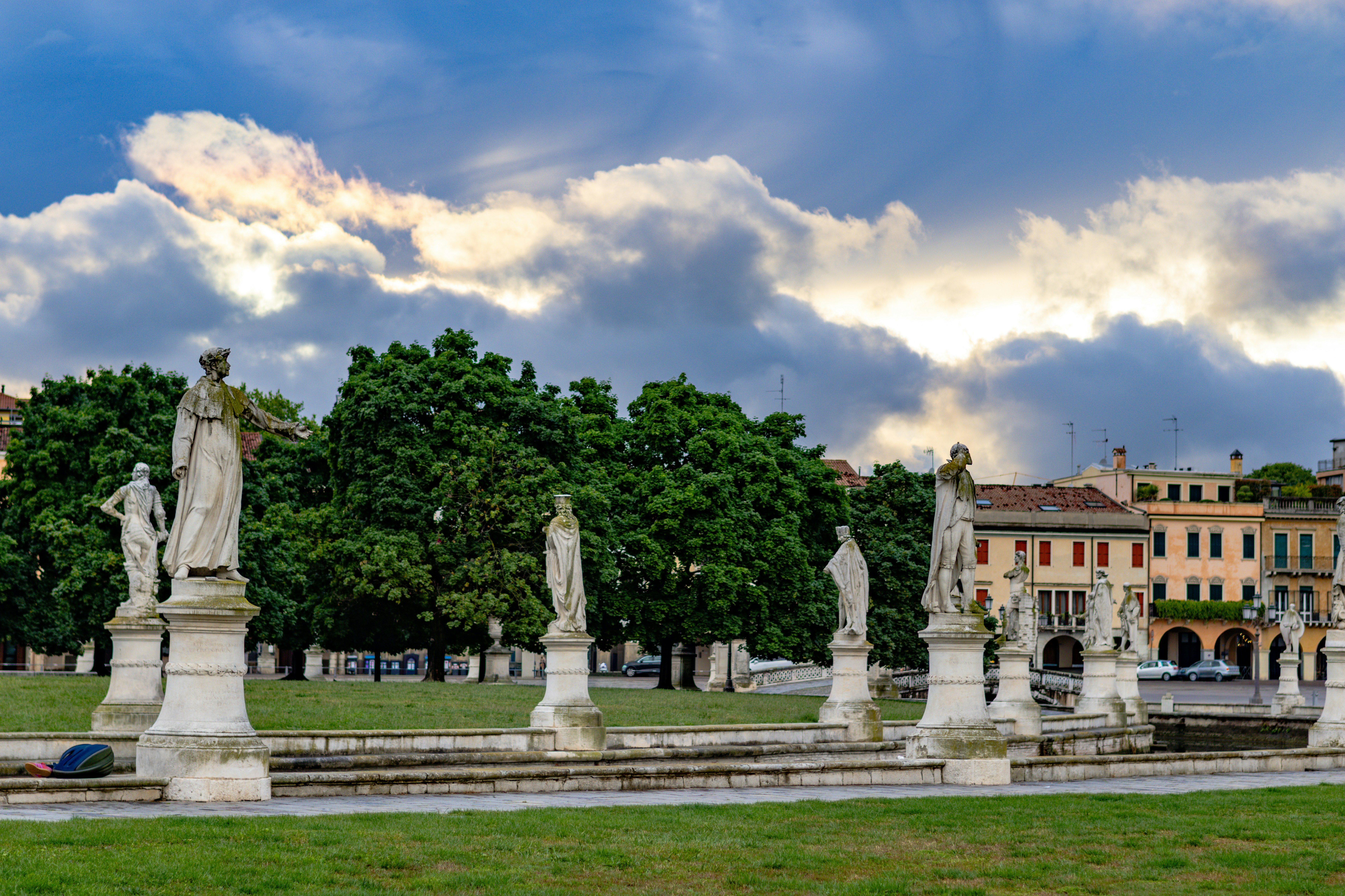 Statues Guard the Palatial Park: A Quiet Day by the Arcaded Bridge