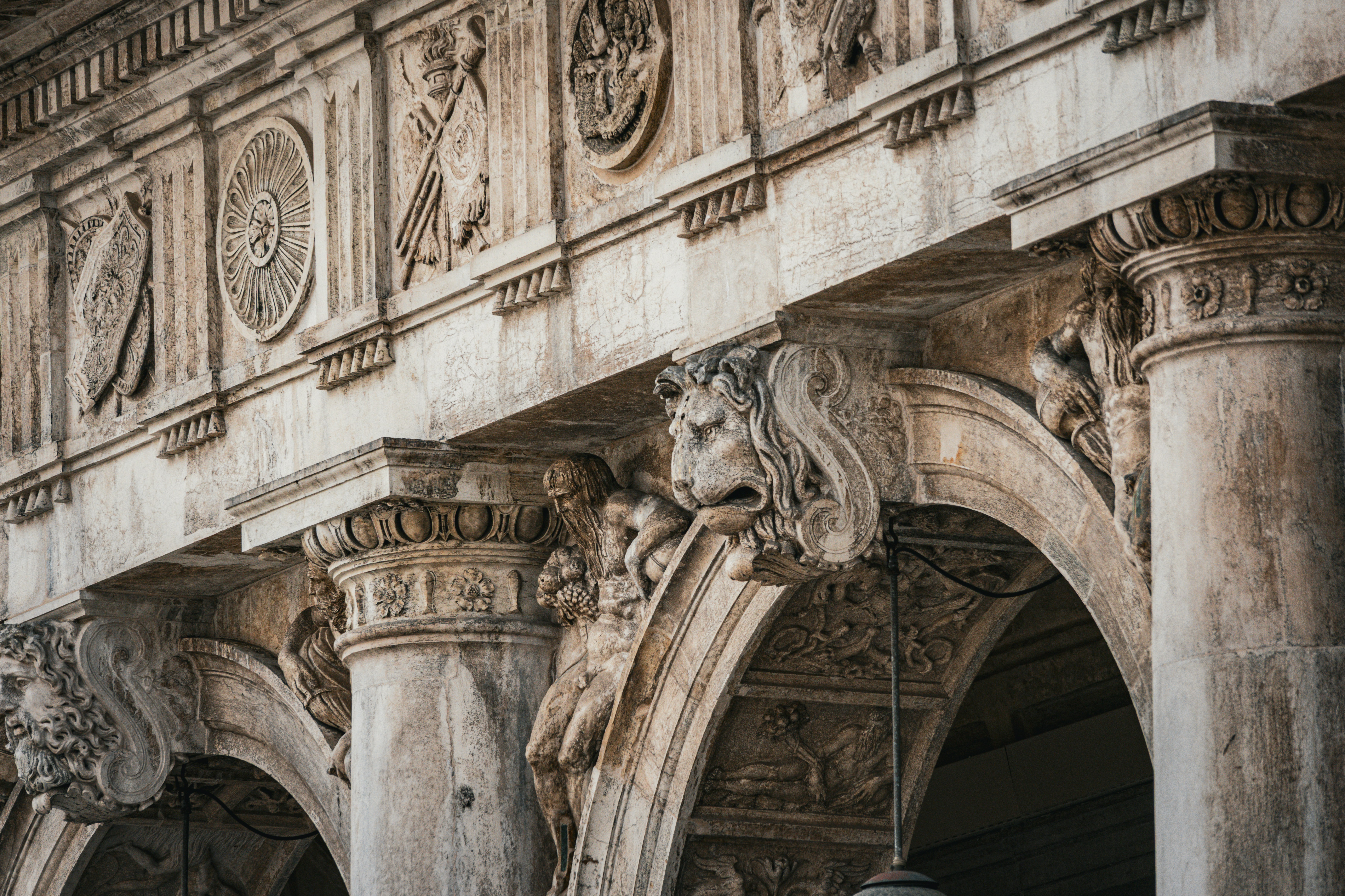 Stone Guardians: Carved Lions Overseeing the Archway