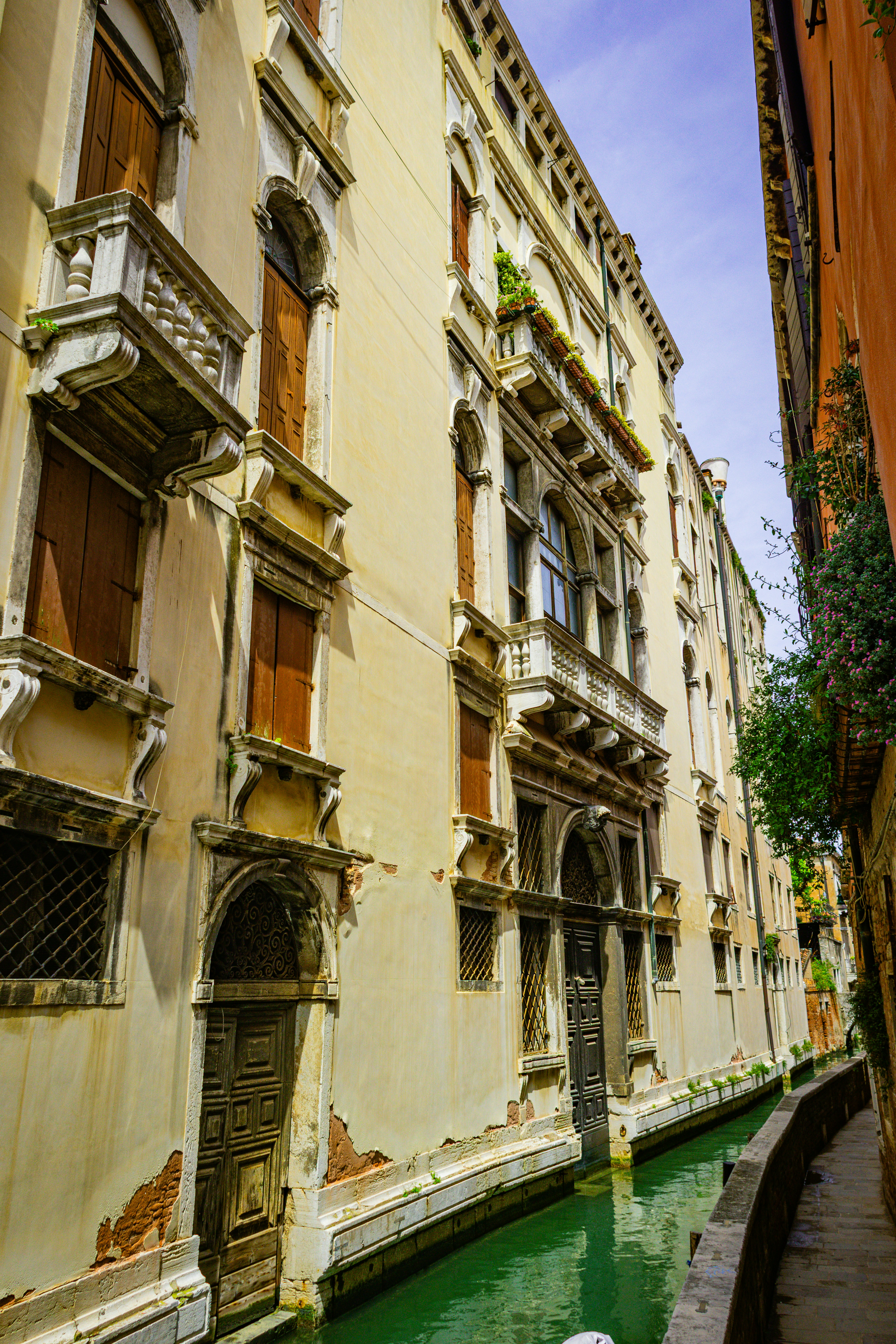 Canalside Facades: Weathered Charm Along a Venetian Alley