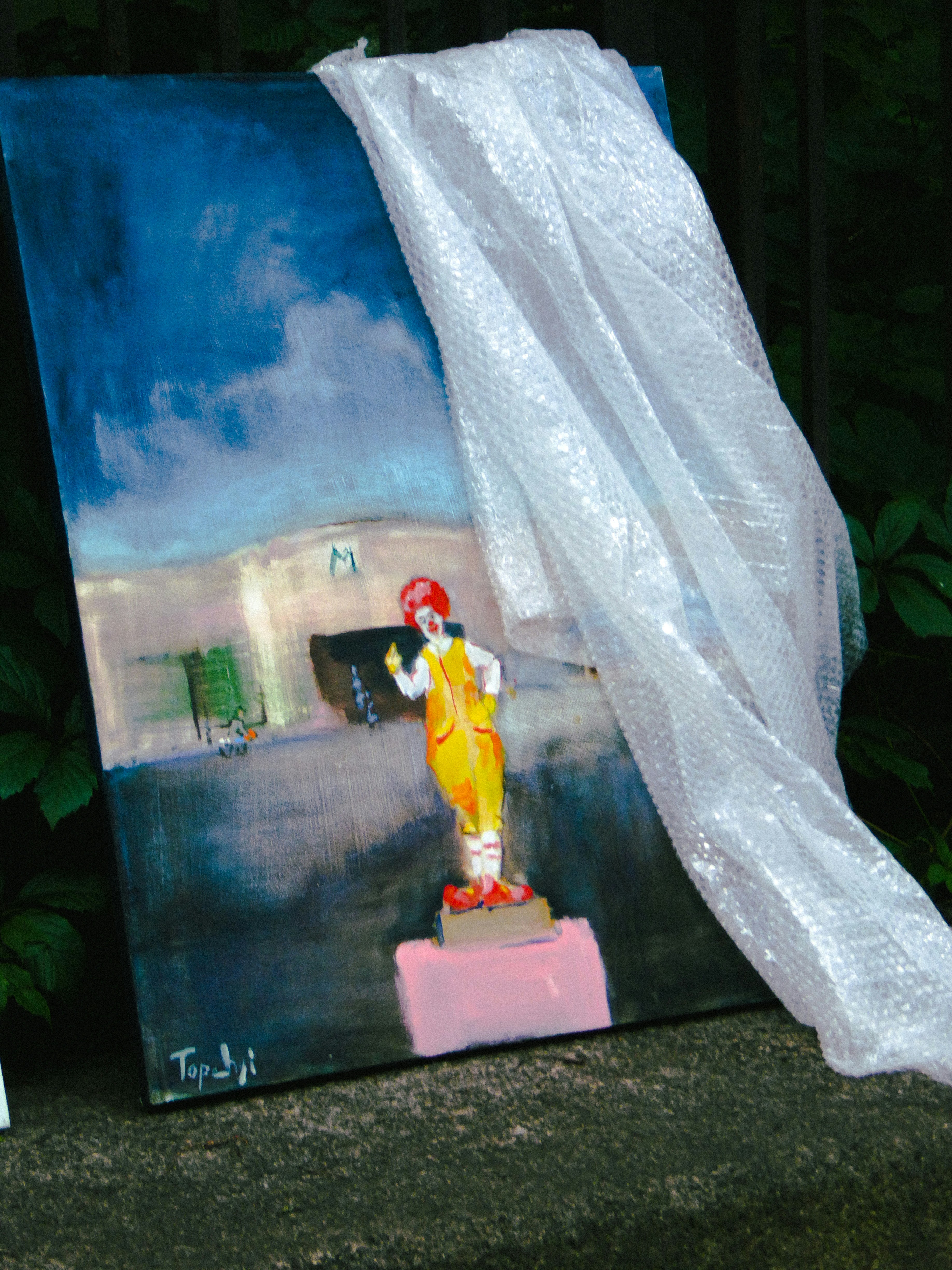 Studio in the Garden: A Painted Figure Beside a Draped Cast