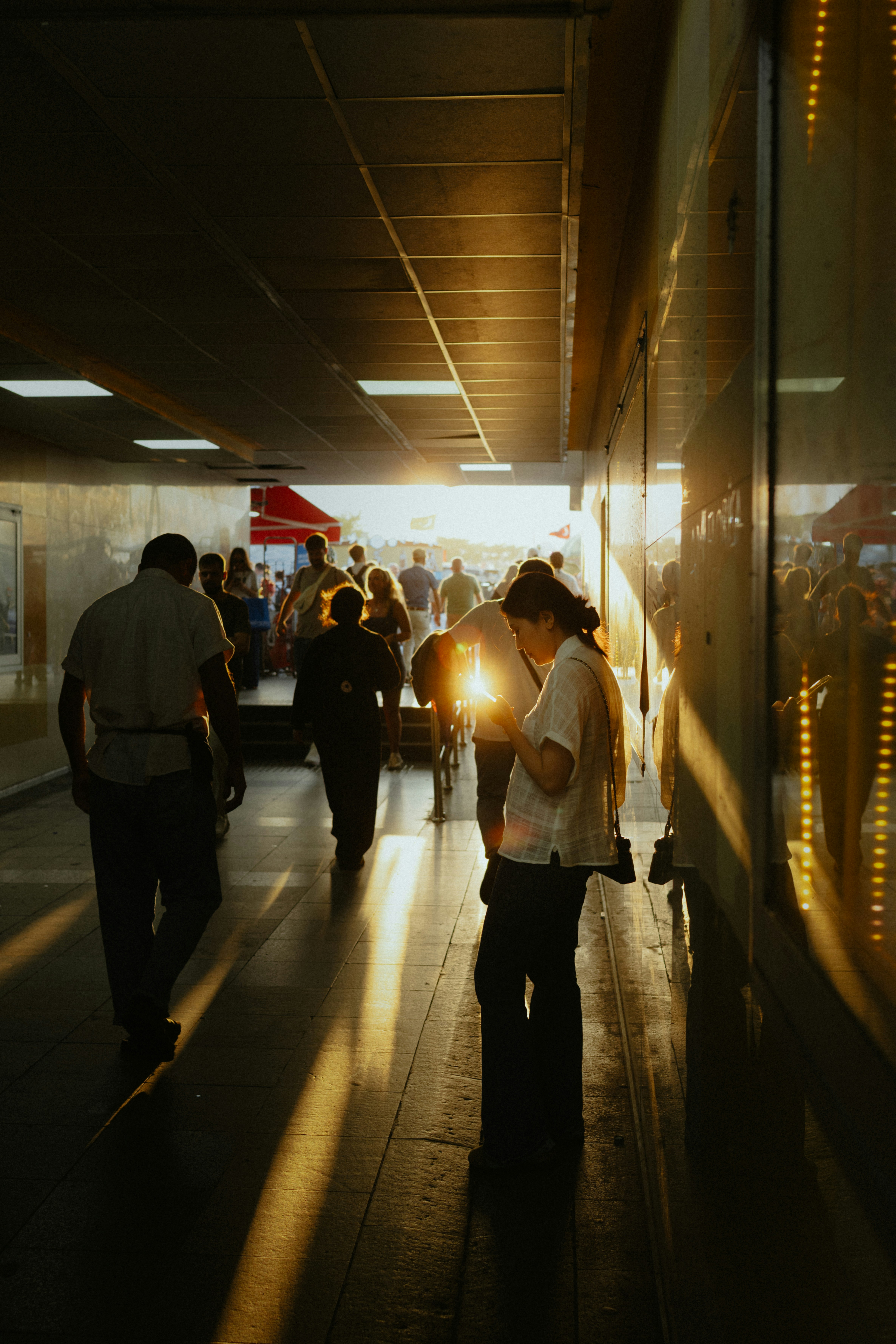 Golden Hour in the Underground: A Stranger’s Quiet Moment at the Transit Atrium
