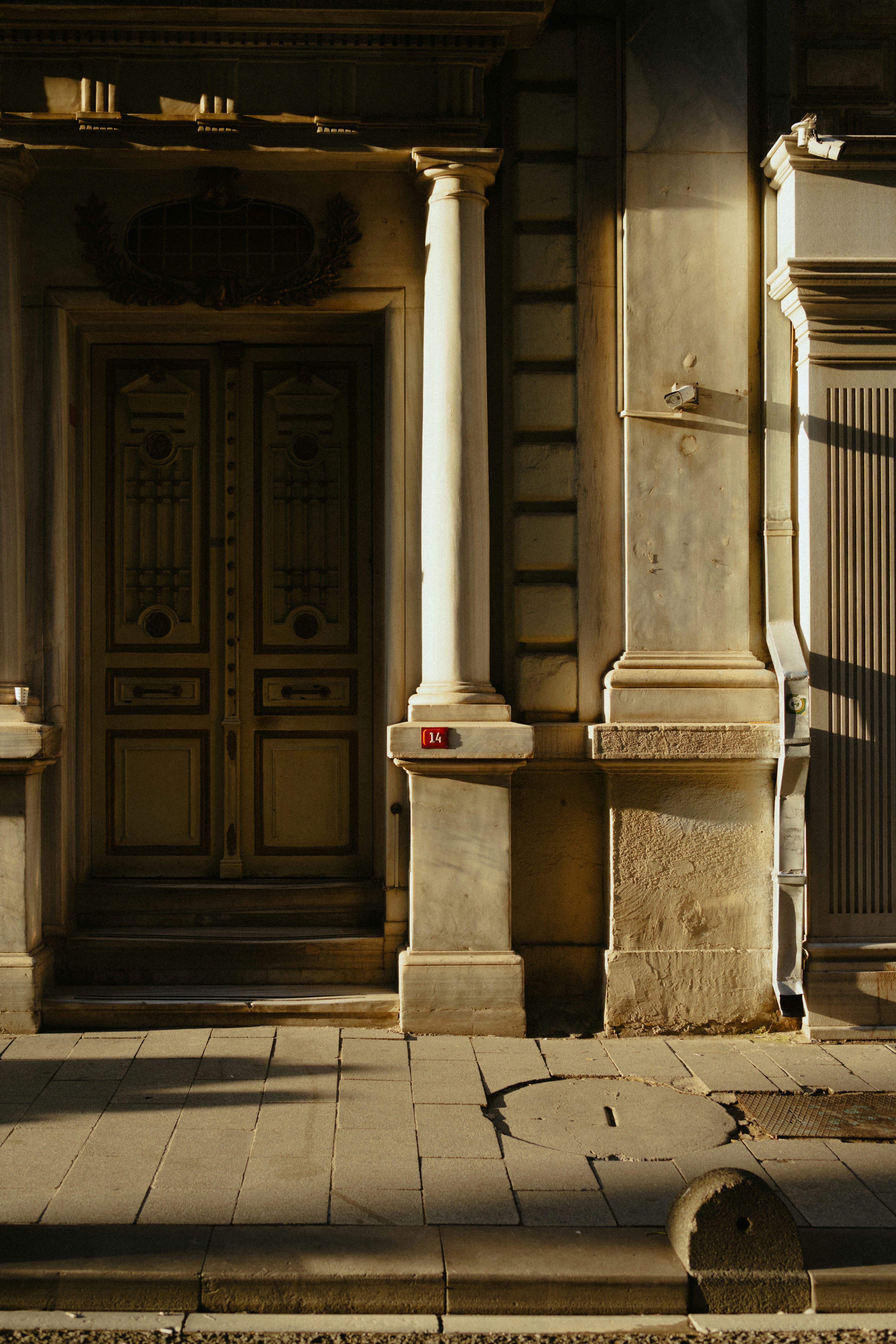 Sunlit Portal: A Classic Doorway Bathed in Evening Shadows