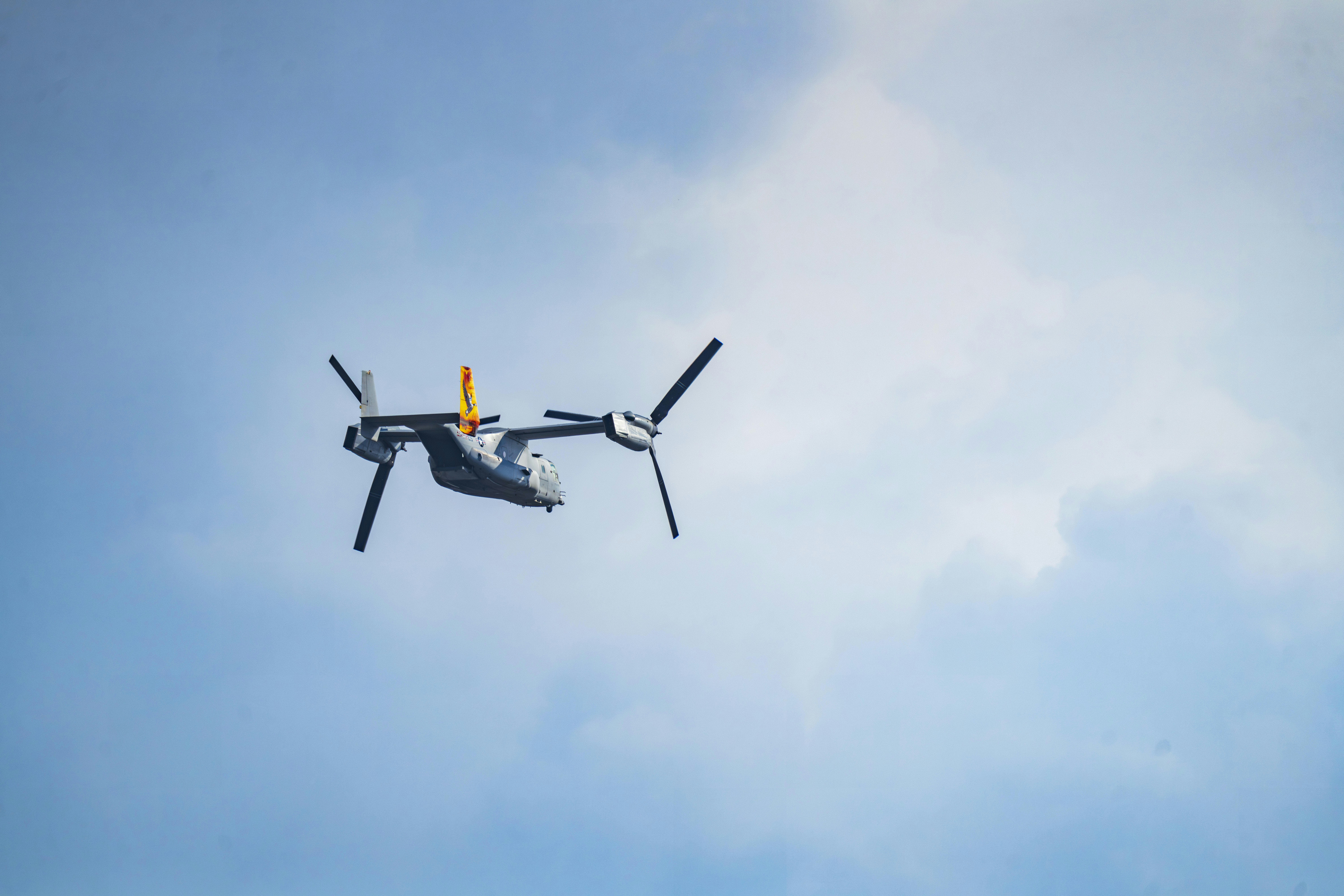 Azure Skies and Rotor Lines: A Distant Drone in Clear Outlook