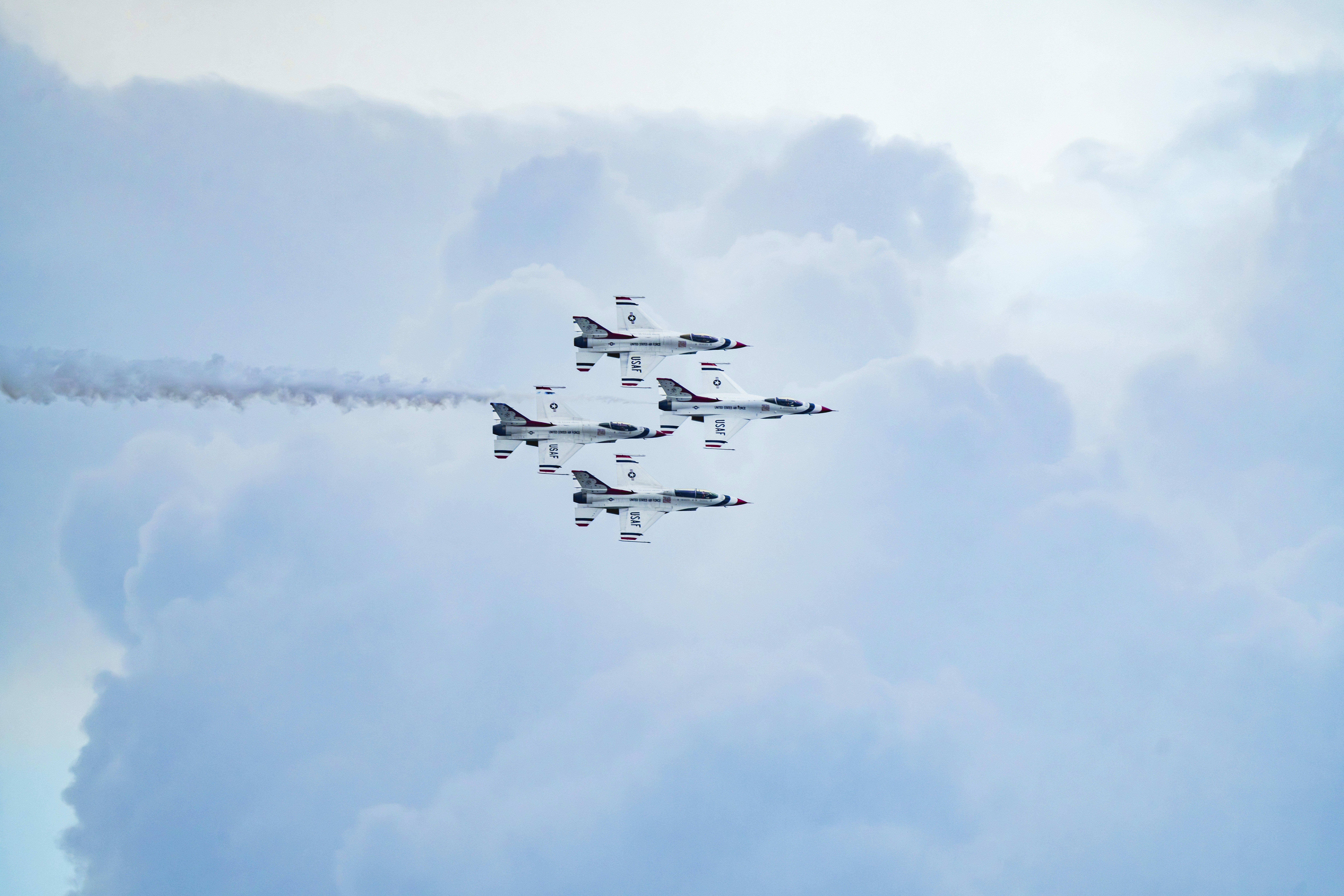 Quartet in Formation: Jet Team Pierces a Sky of Cotton