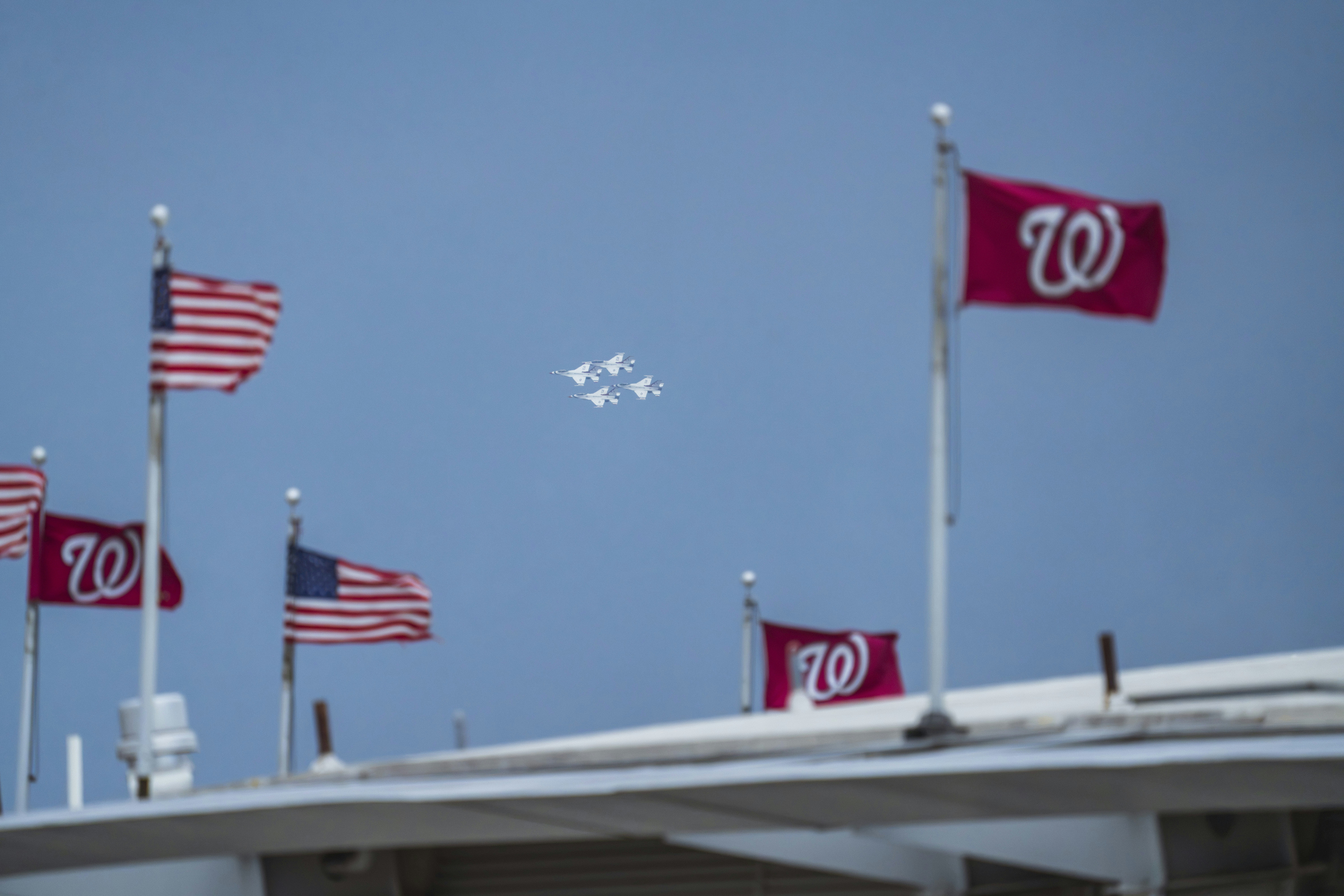 Whispers of Flight Over a Flag-Filled Roof