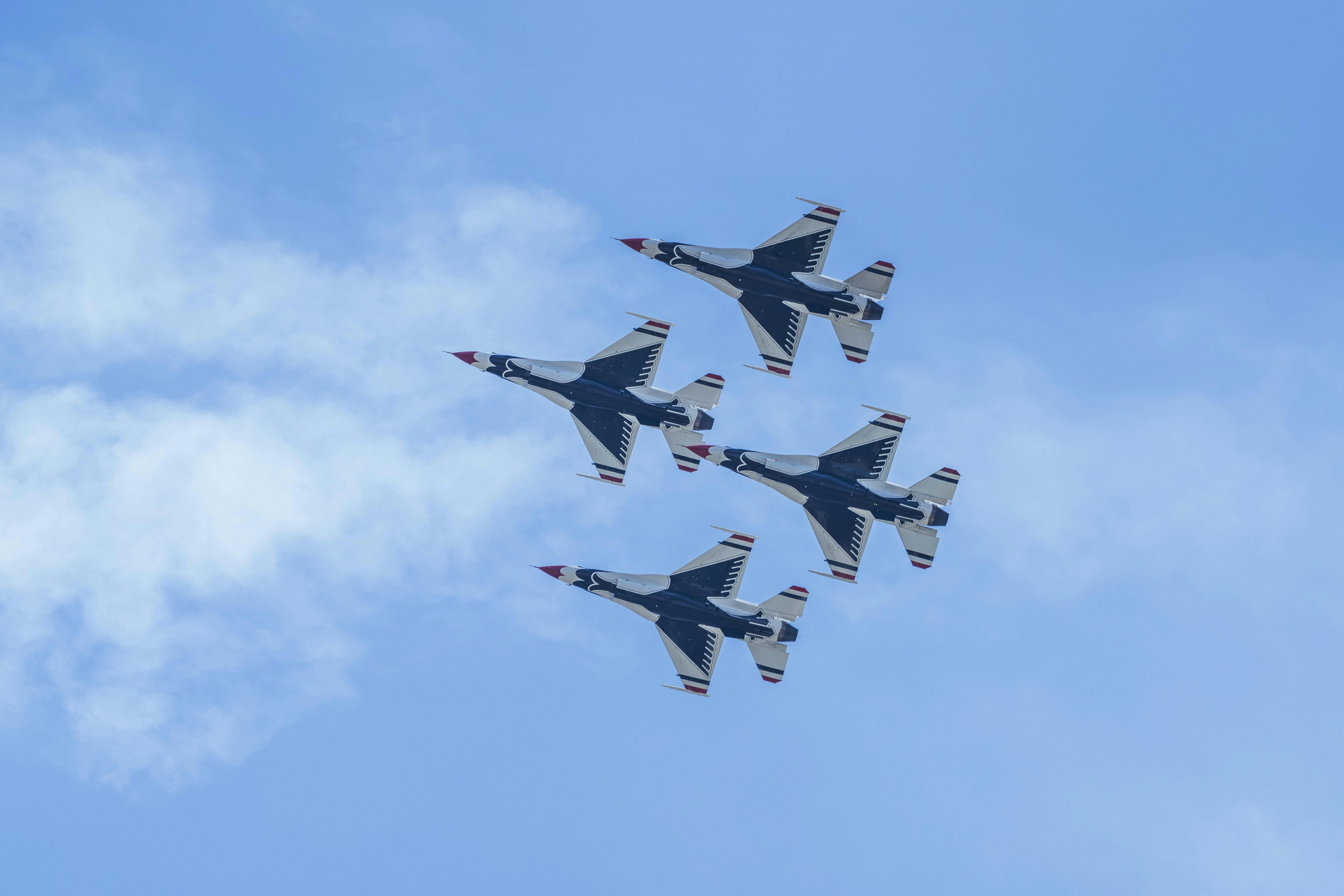 Four Thunder in Formation: Precision Jets against a Clear Blue Sky
