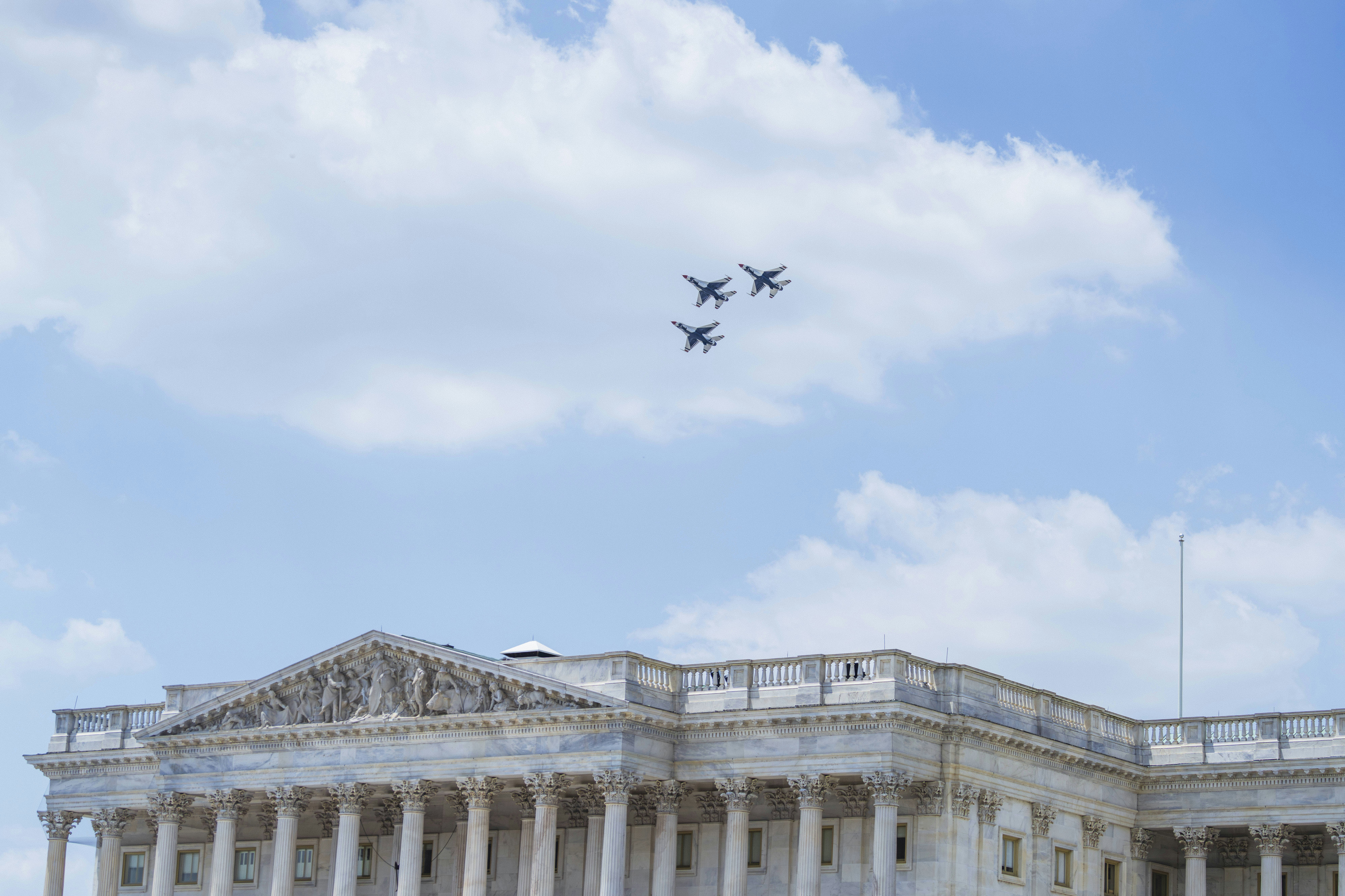 Three-jet formation over a classical façade