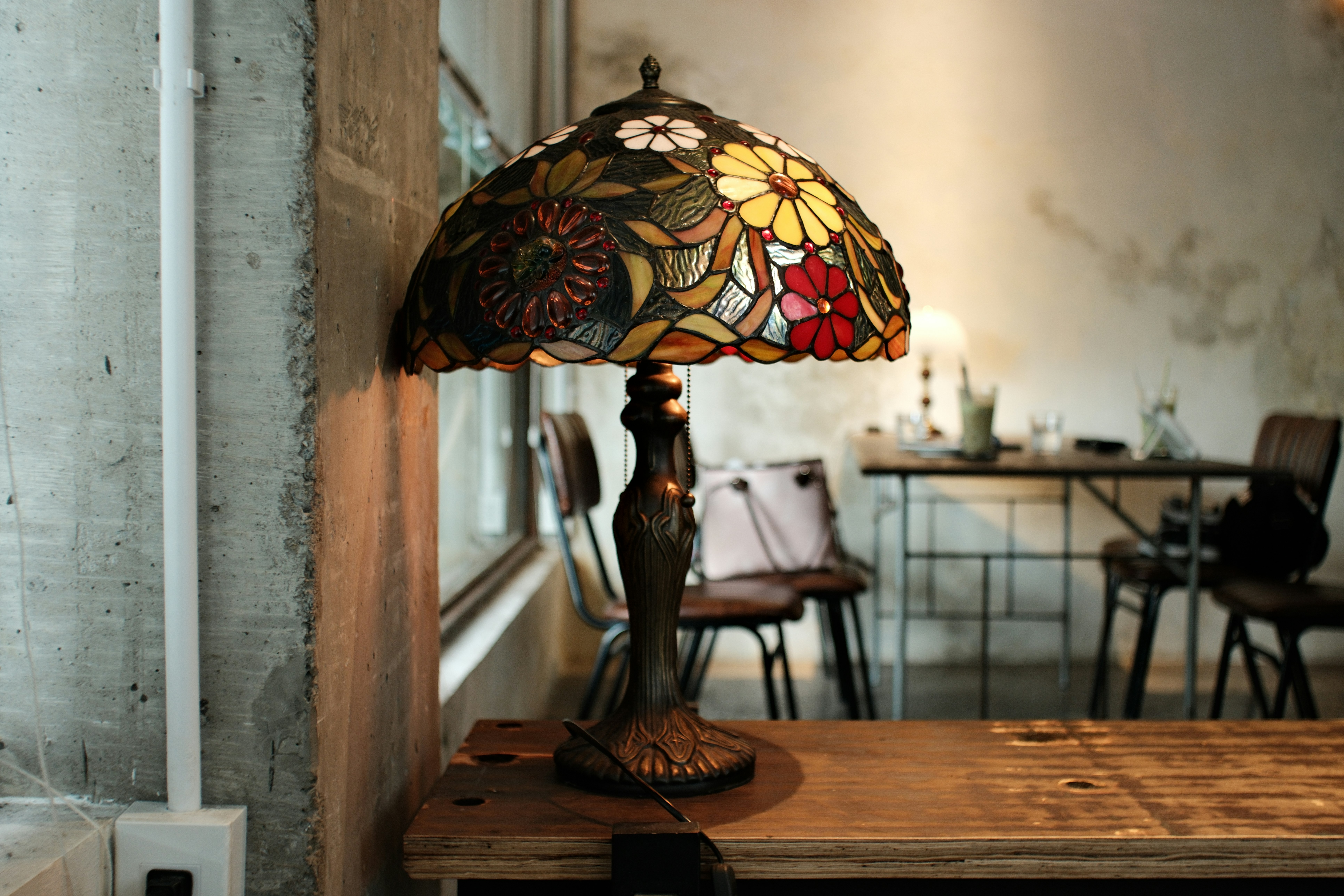 Stained-Glass Lamp on Weathered Table in Quiet Atelier