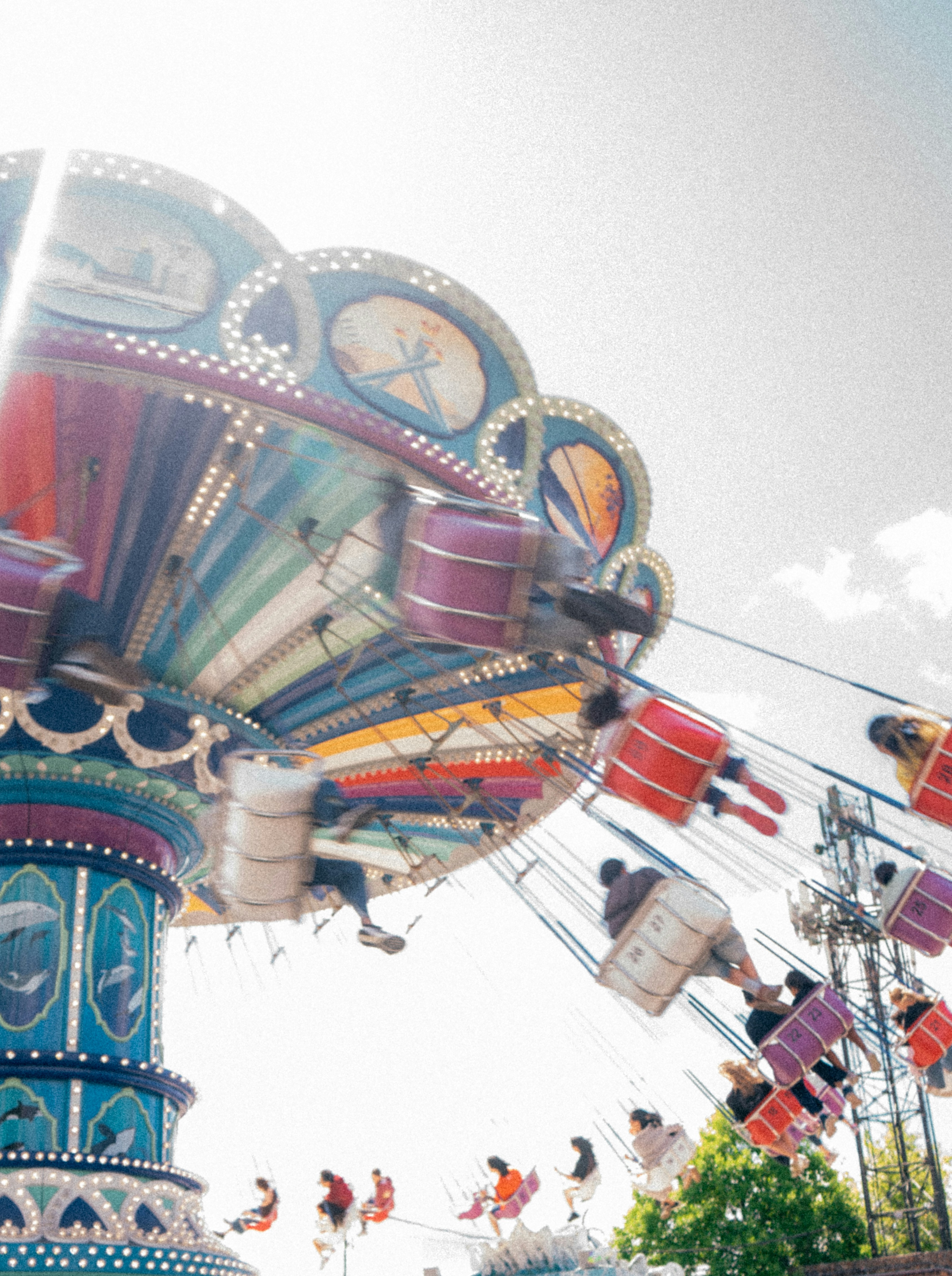 Whirl of Color: A Sunset Spin on the Fairground Lift