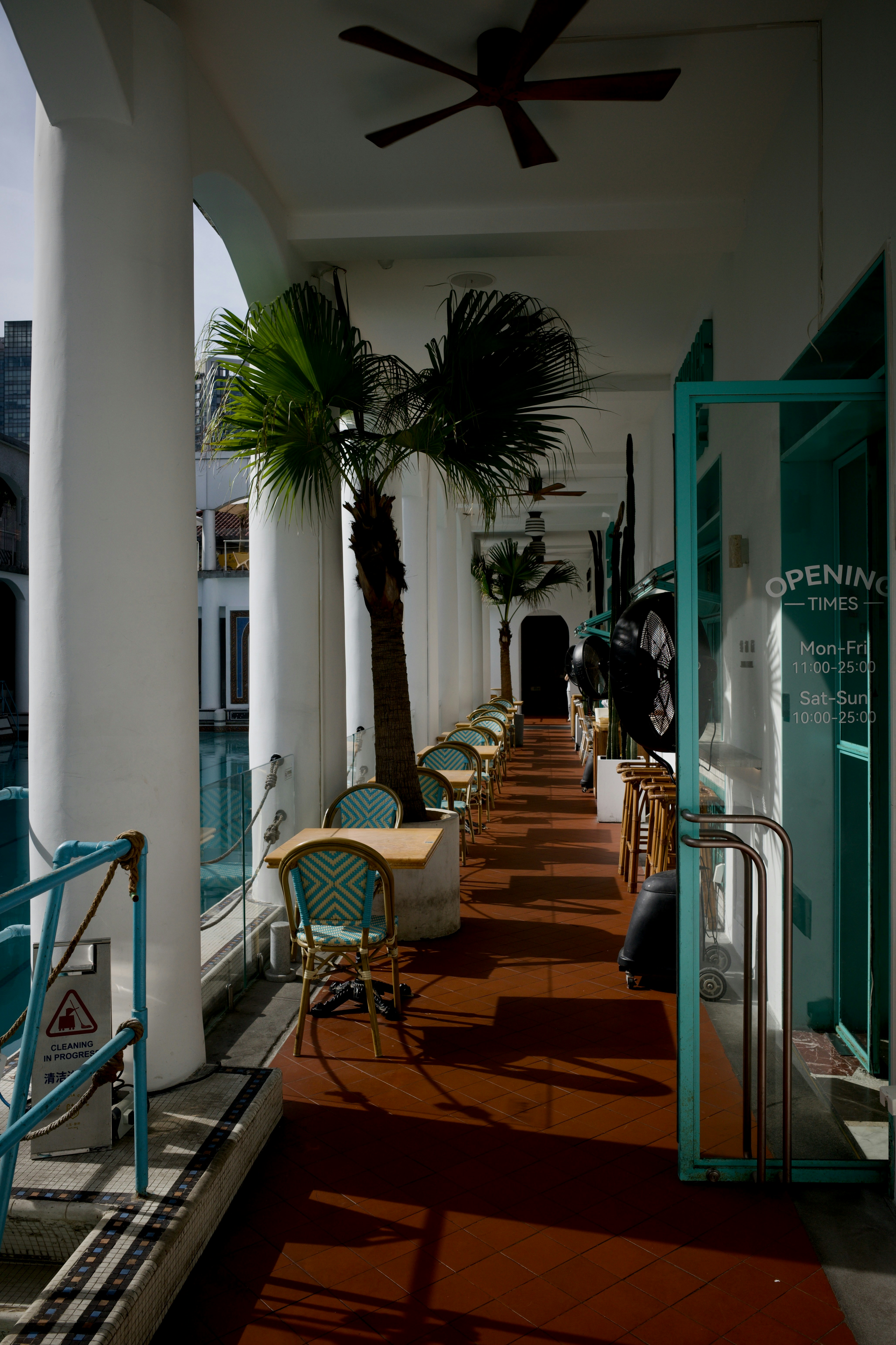 Shaded Corridor of Palm Oases by the Poolside