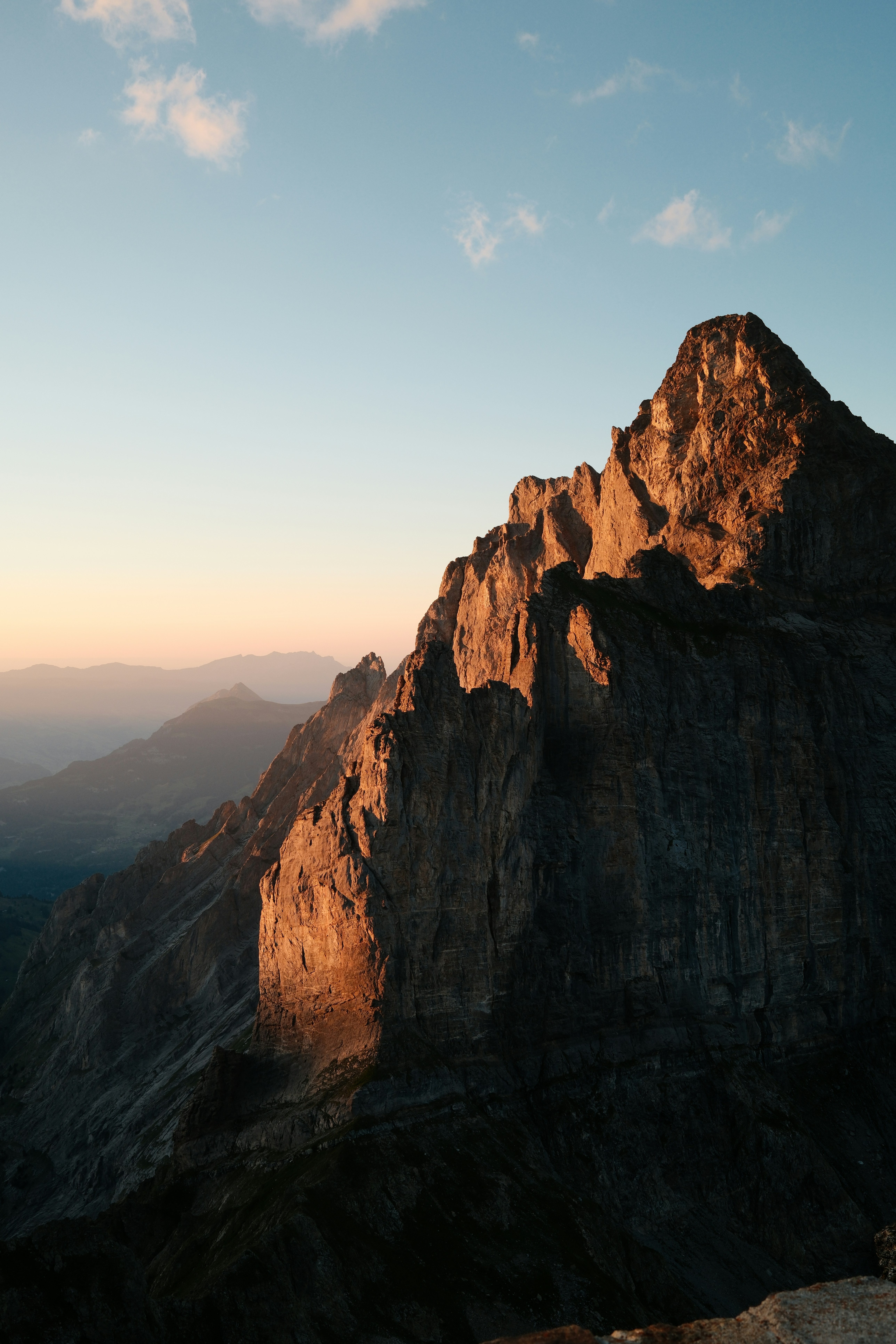 Sunlit Spire: A Peak Bathed in Golden Dusk