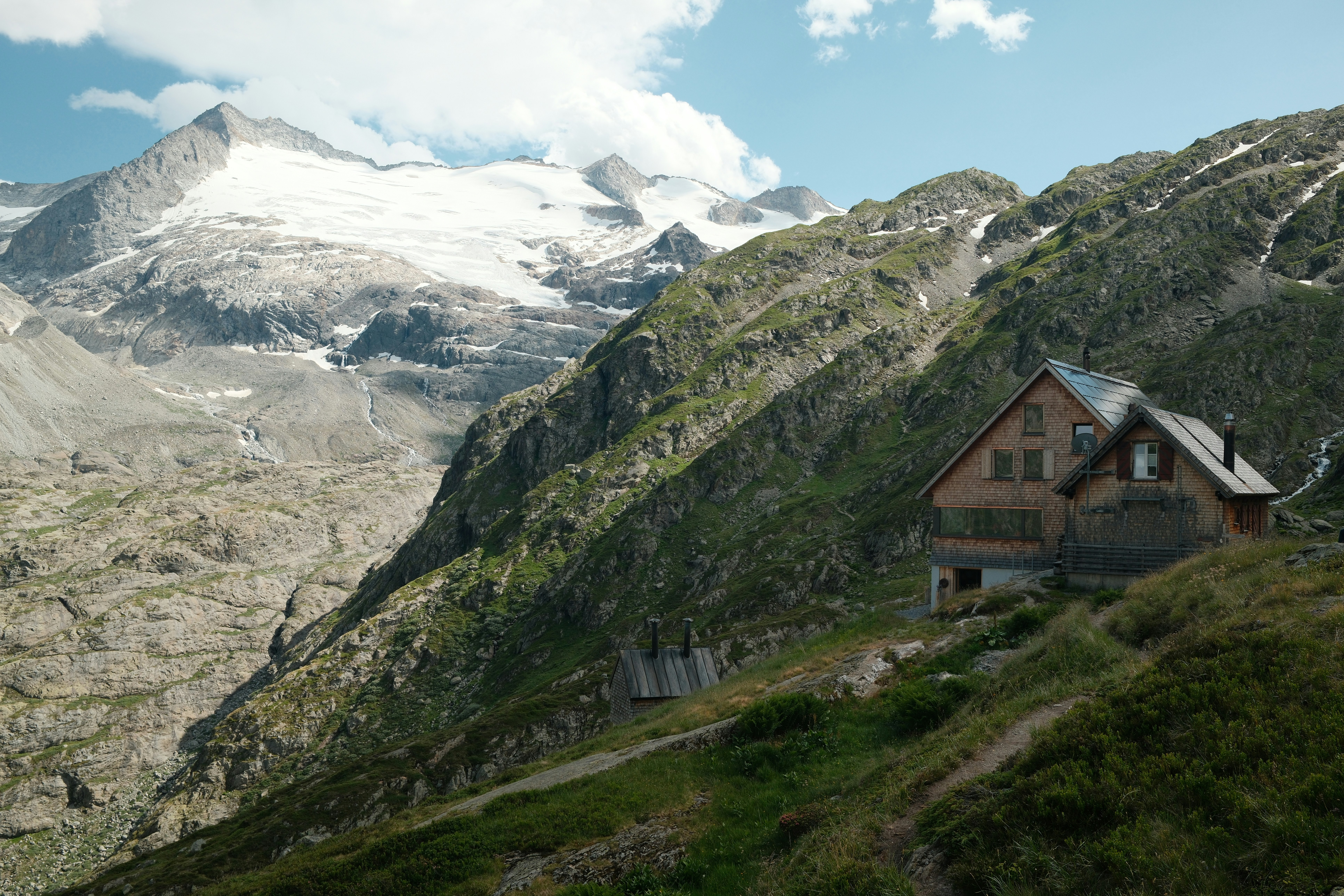 Hermit House Amid Alpine Giants