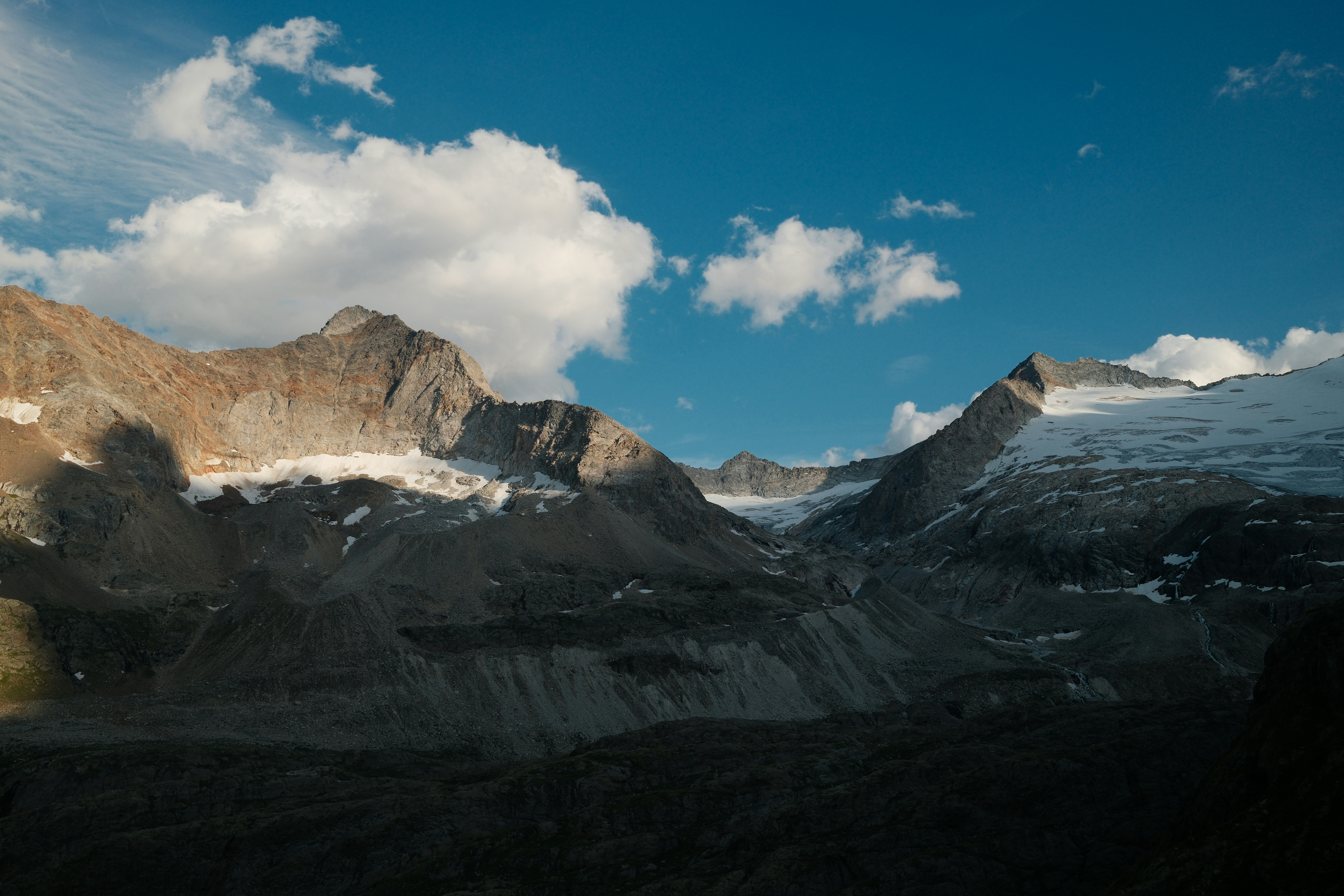 Glacial Crest Under a Vast Alpine Sky