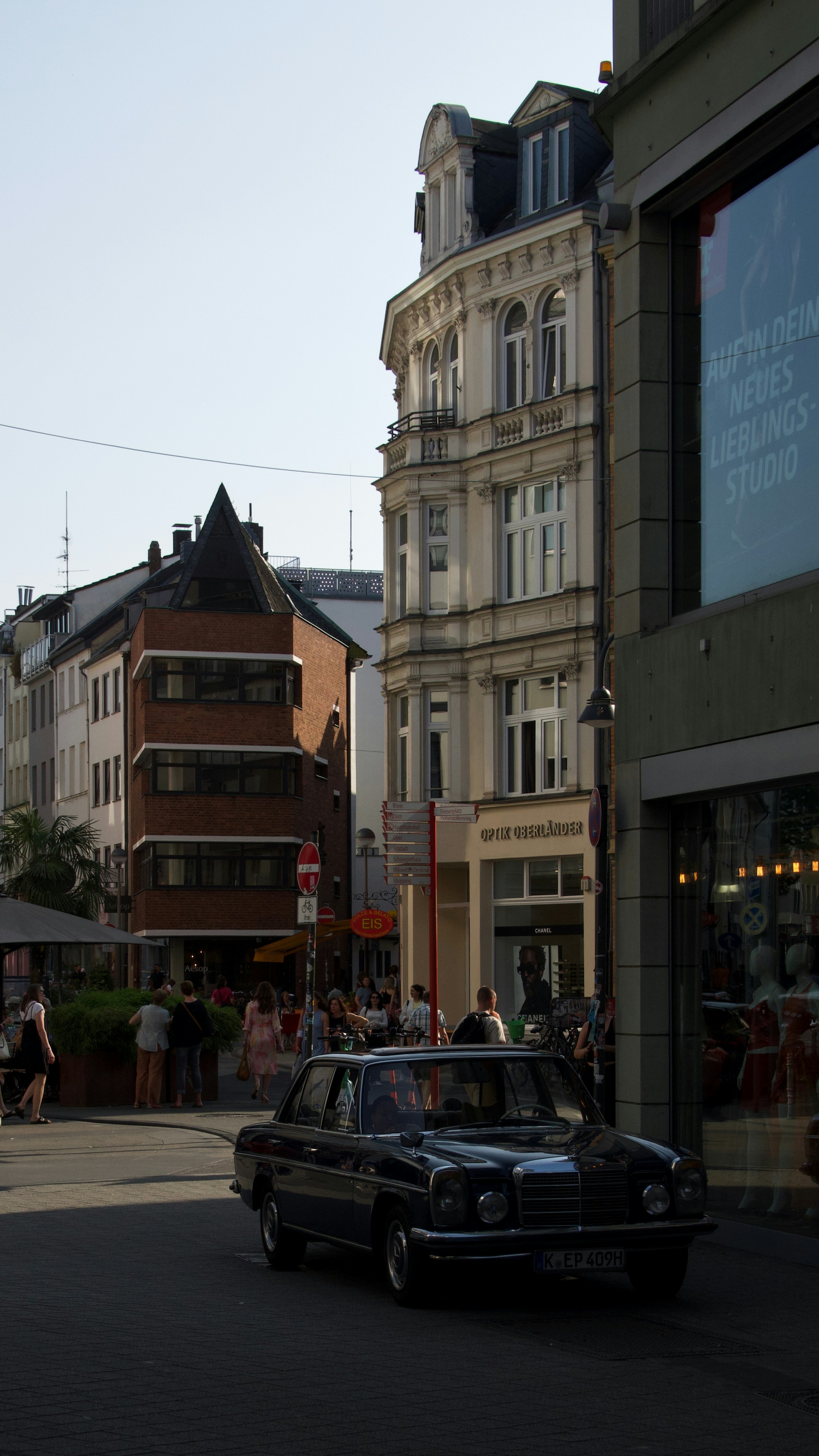 Classic Street Scene with Vintage Mercedes Beneath Architectural Facades