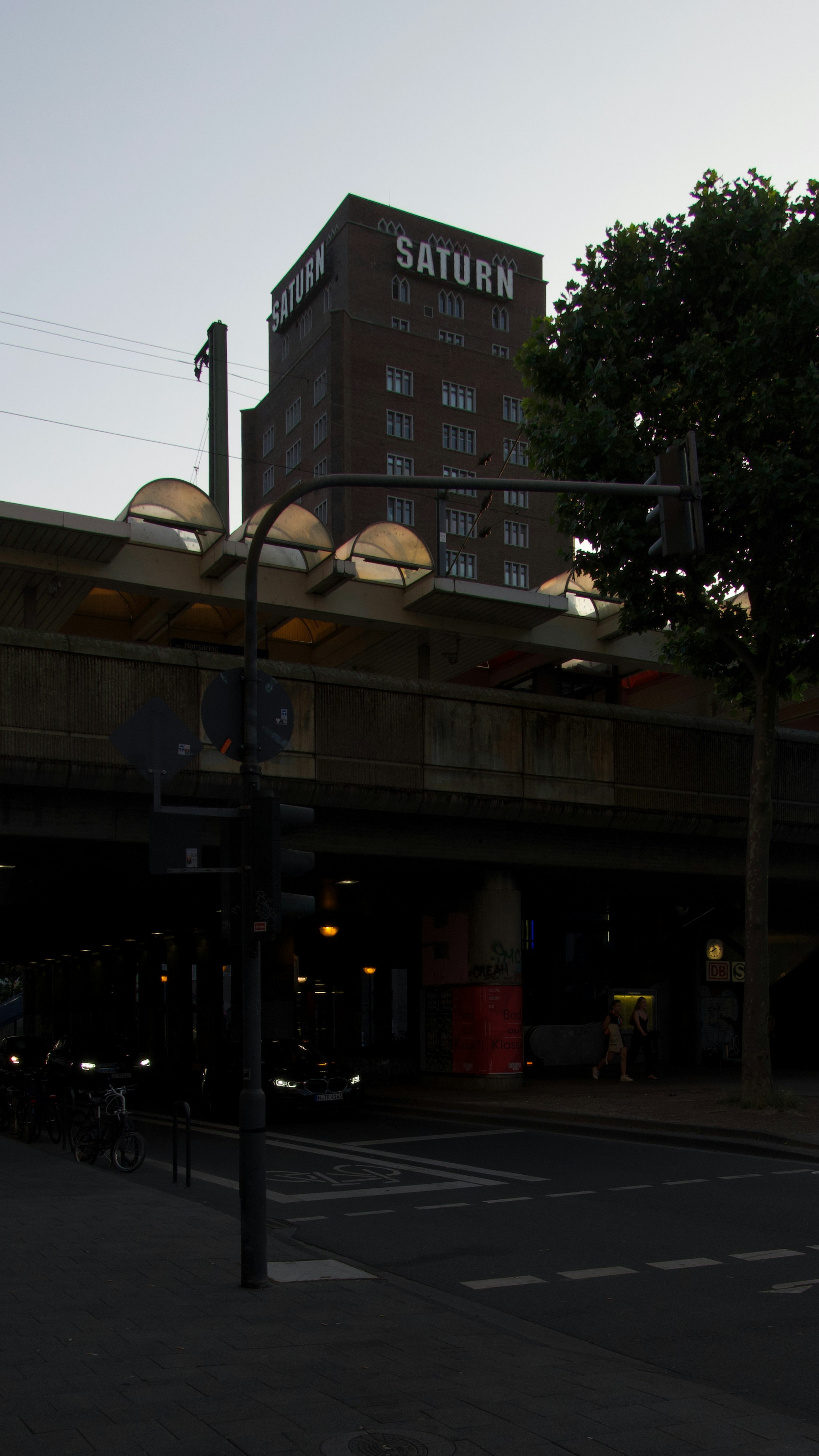 Saturn Tower Overpass: Evening Light on a Manhattan-Style Street