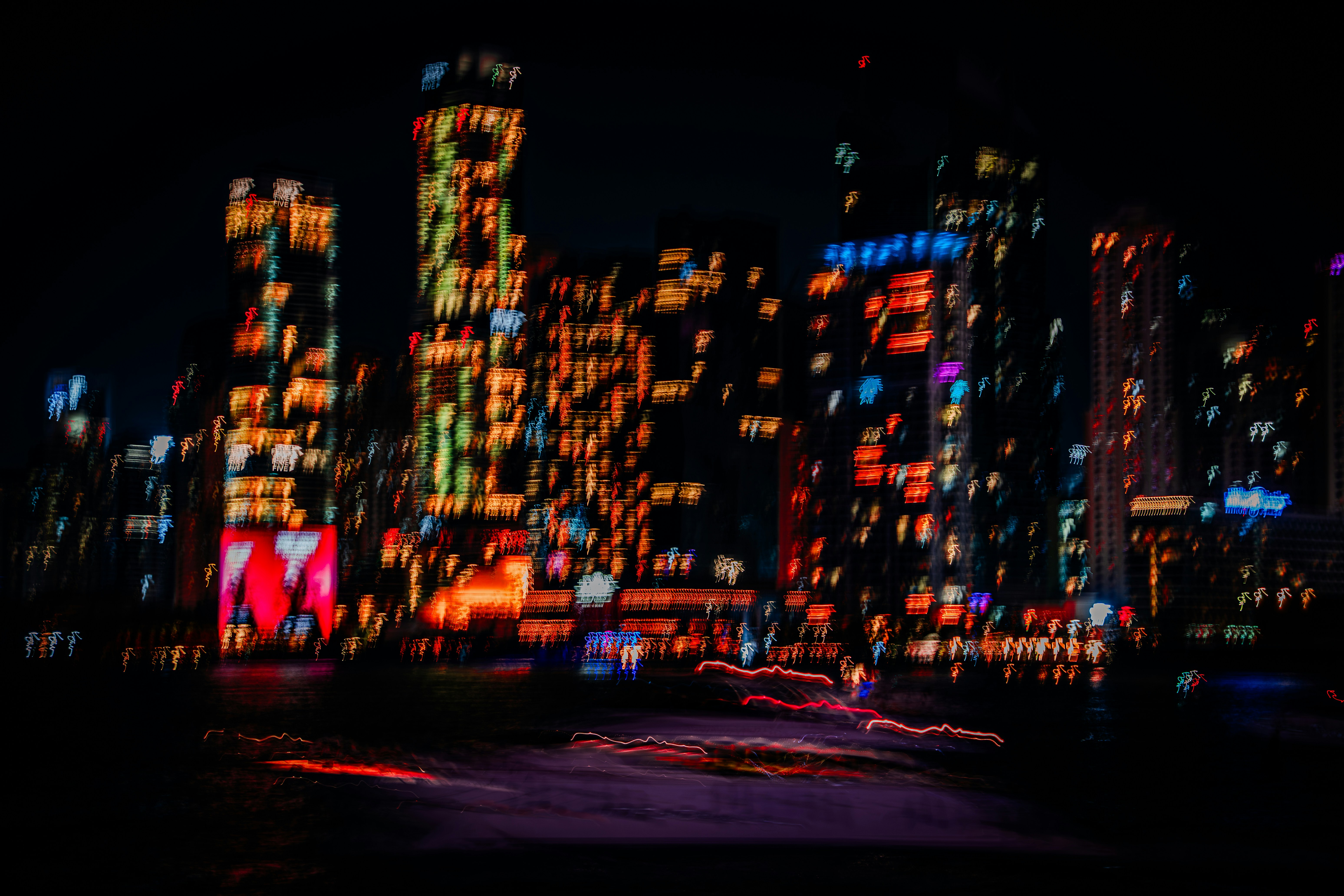 Neon Waterfront Blur: Midnight Skyline on the River