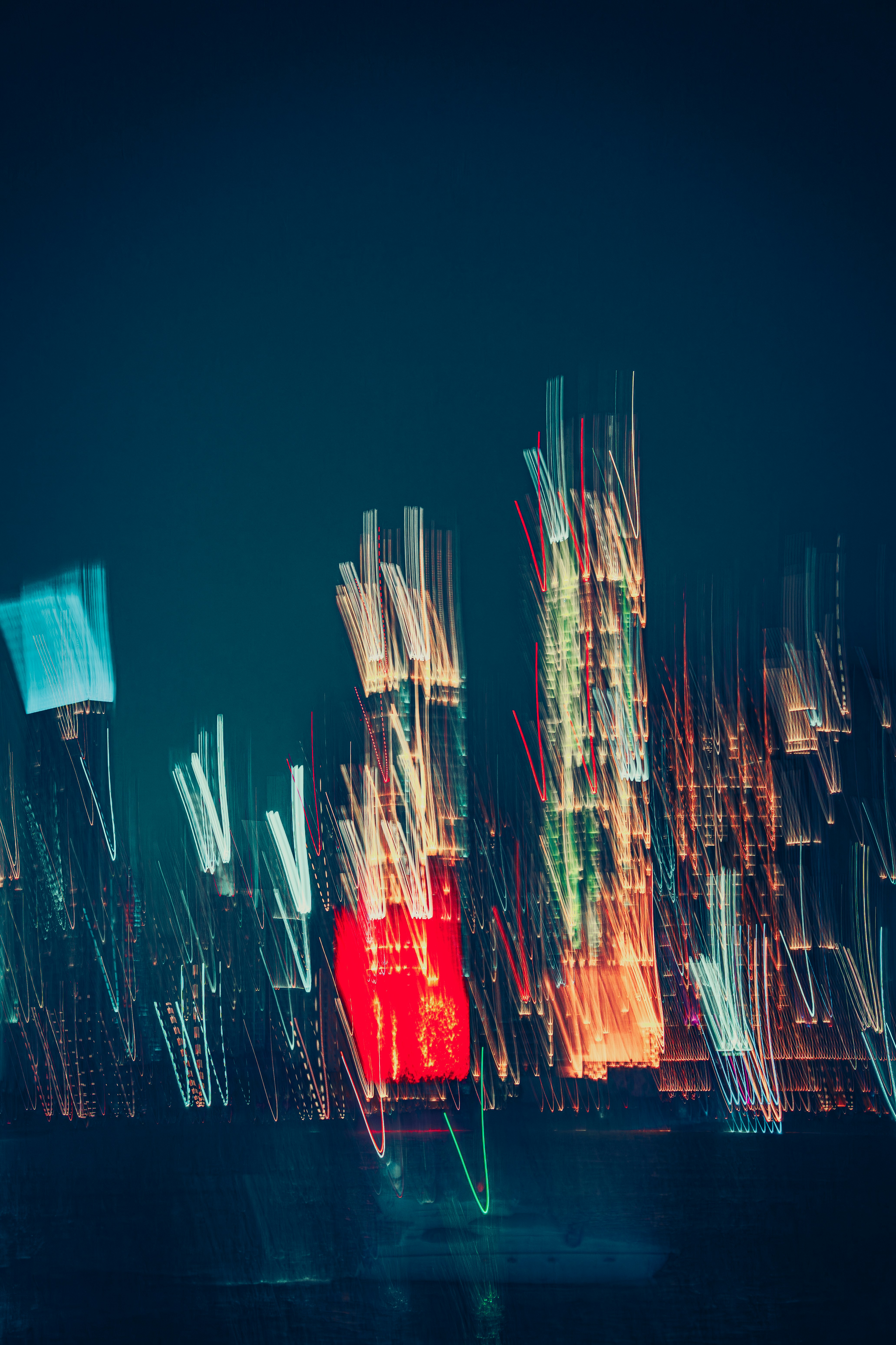 Urban Light Trails: Neon Scrim Over a City’s Horizon