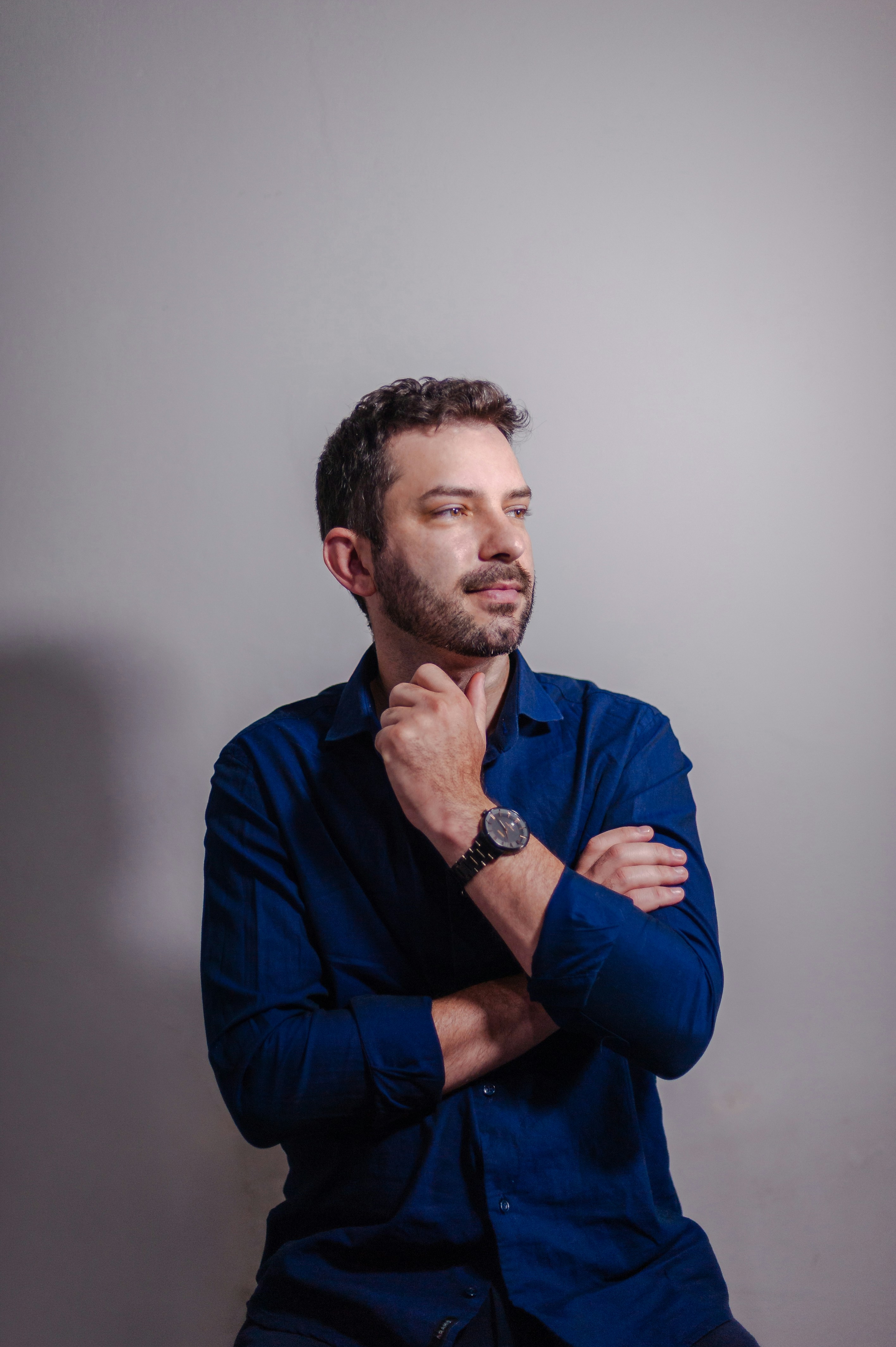 Thoughtful Gaze in a Midnight-Blue Shirt