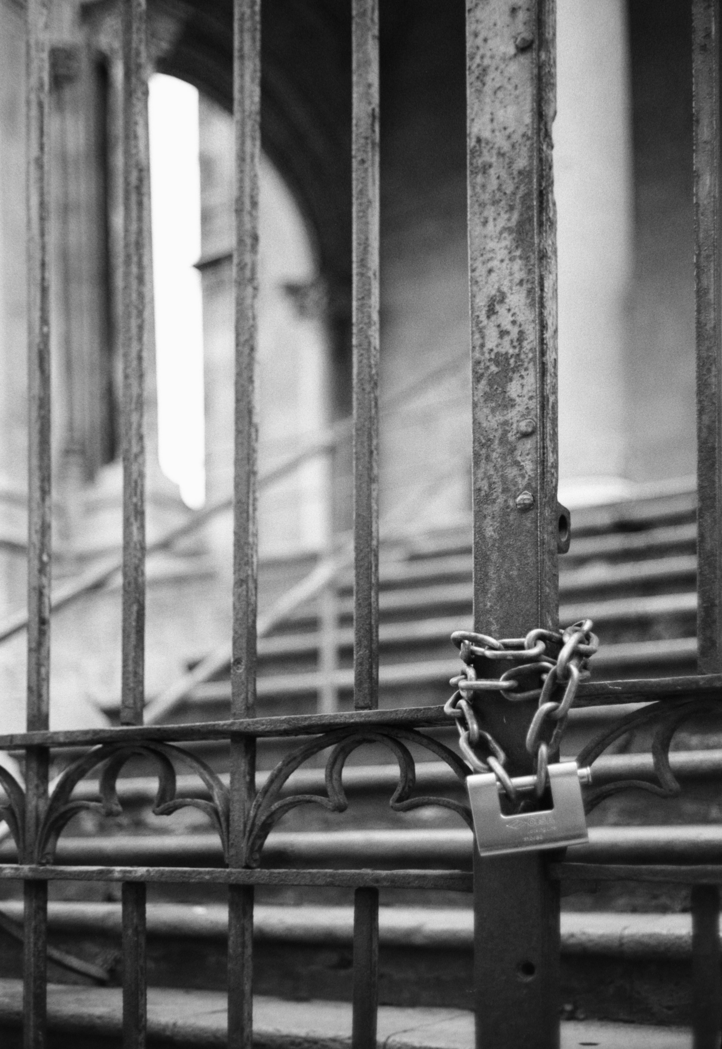 Locked Gate, Quiet Stairs: A Rusted Moment of Stillness