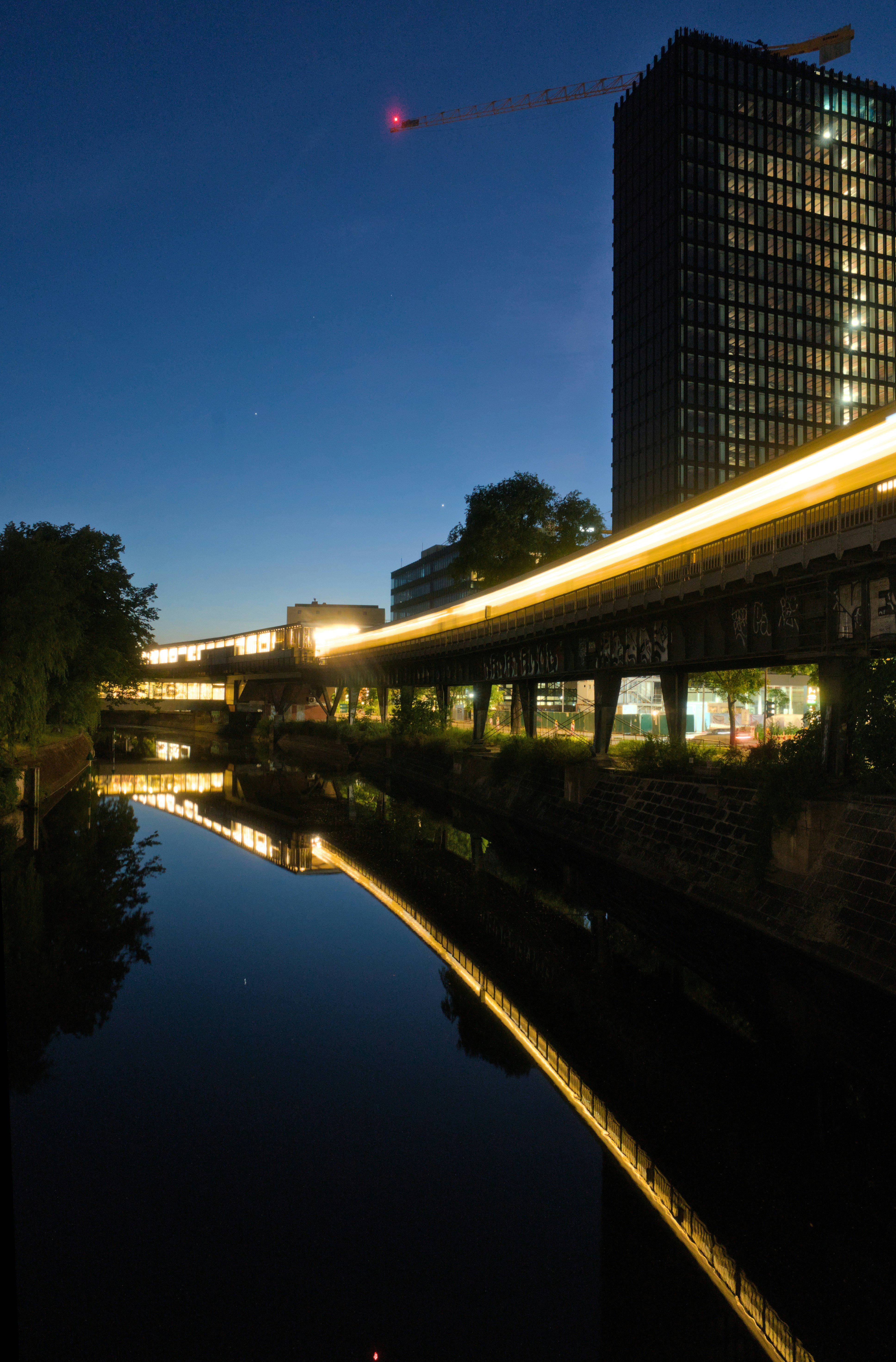 Glow over the Thames: Nighttime Transit Under a Neon Sky