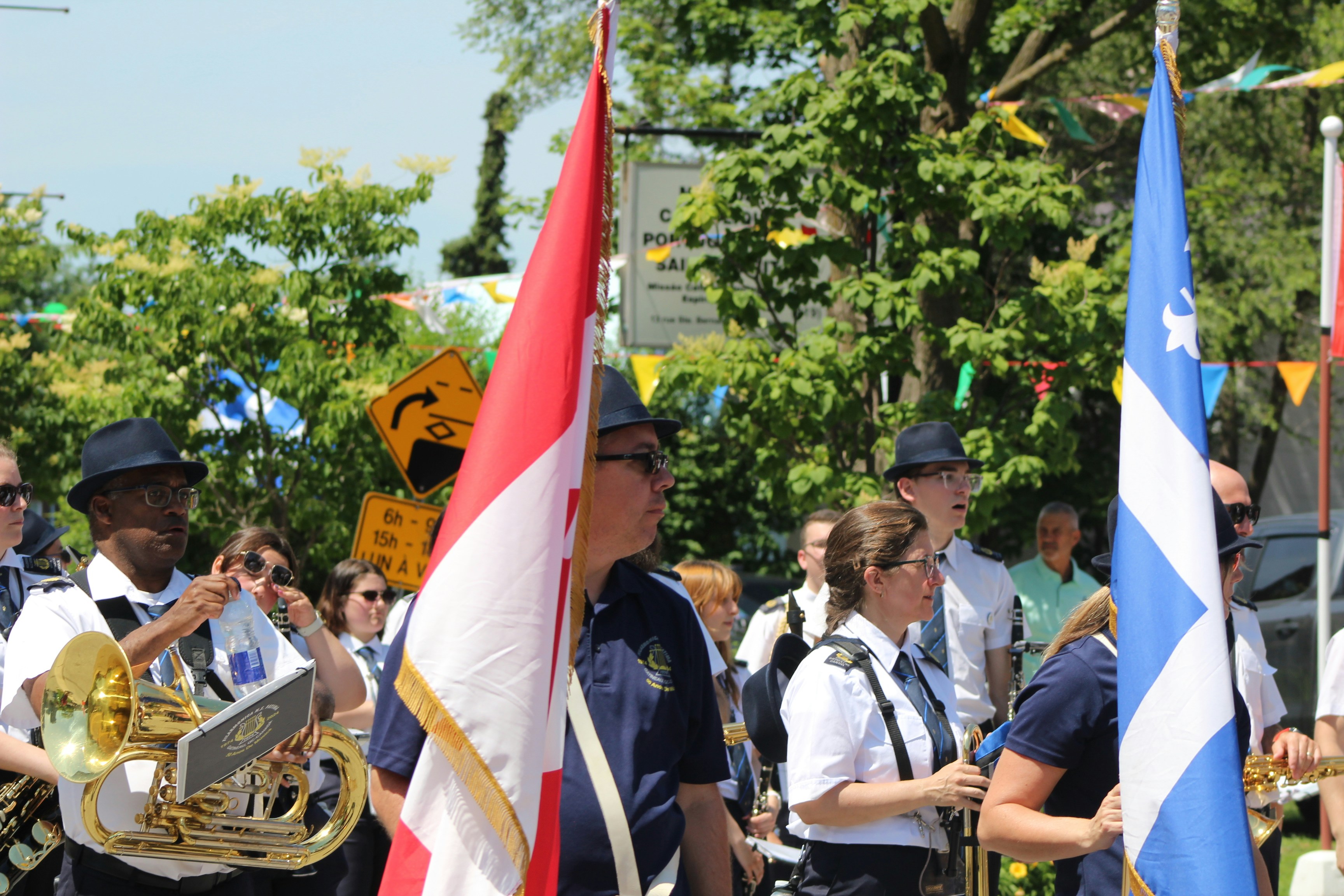 Parade March: Musicians and Flags Amid a Sunny Street