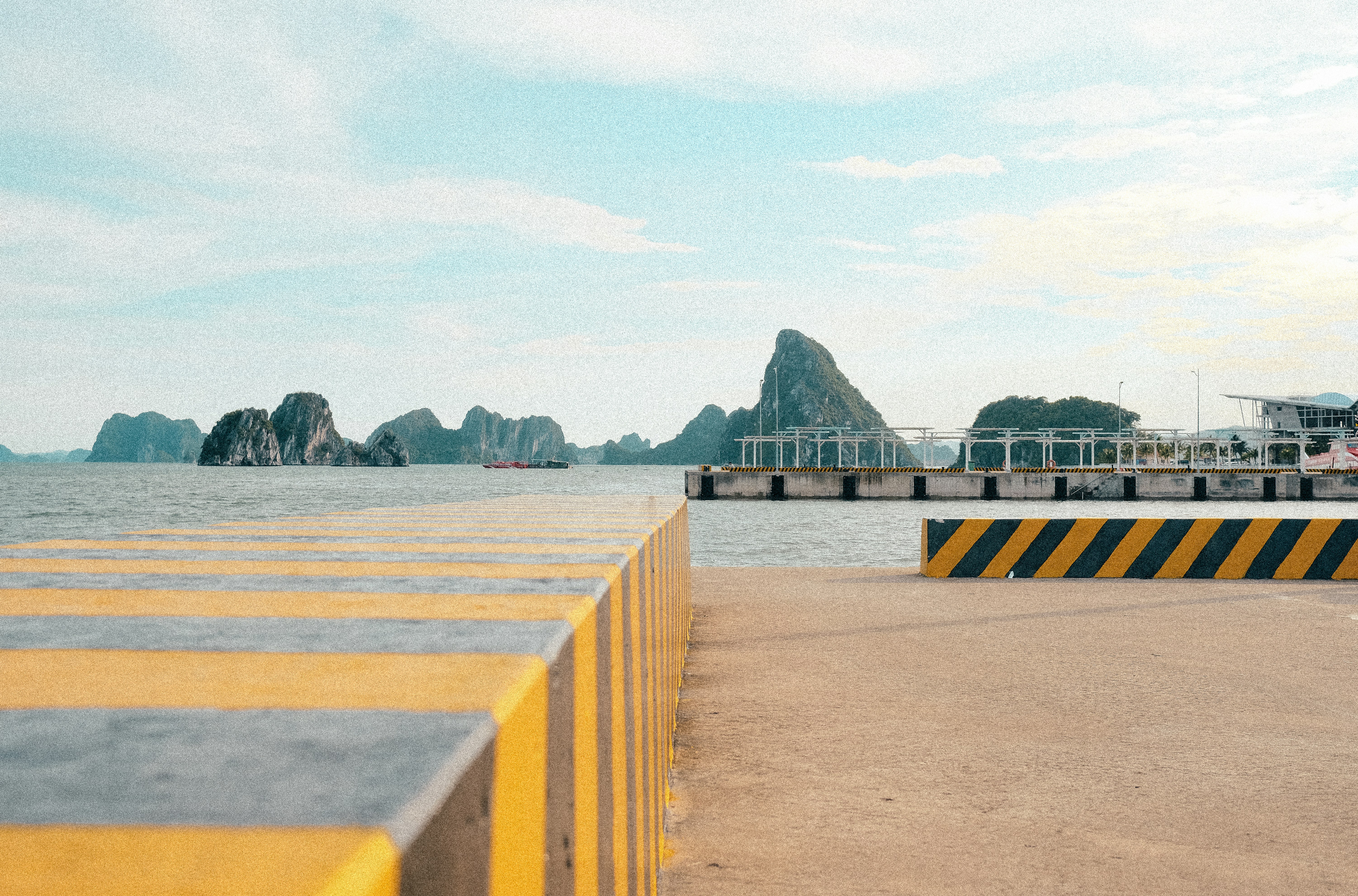 Yellow-Topped Breakwaters Meet the Distant Island Arc