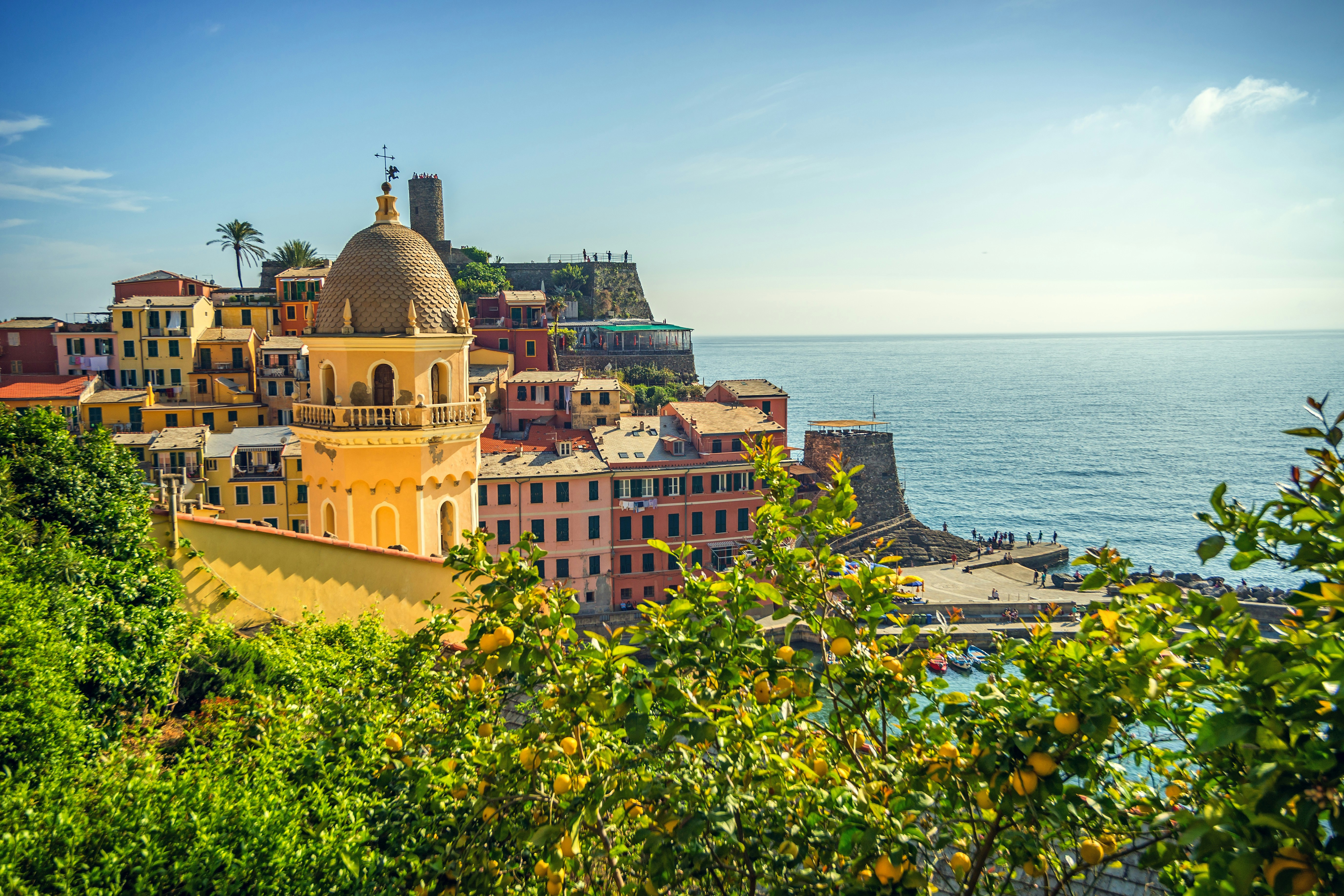 Yellow Domed Chapel Amidst Painted Cliffside Villages Overlooking the Sea