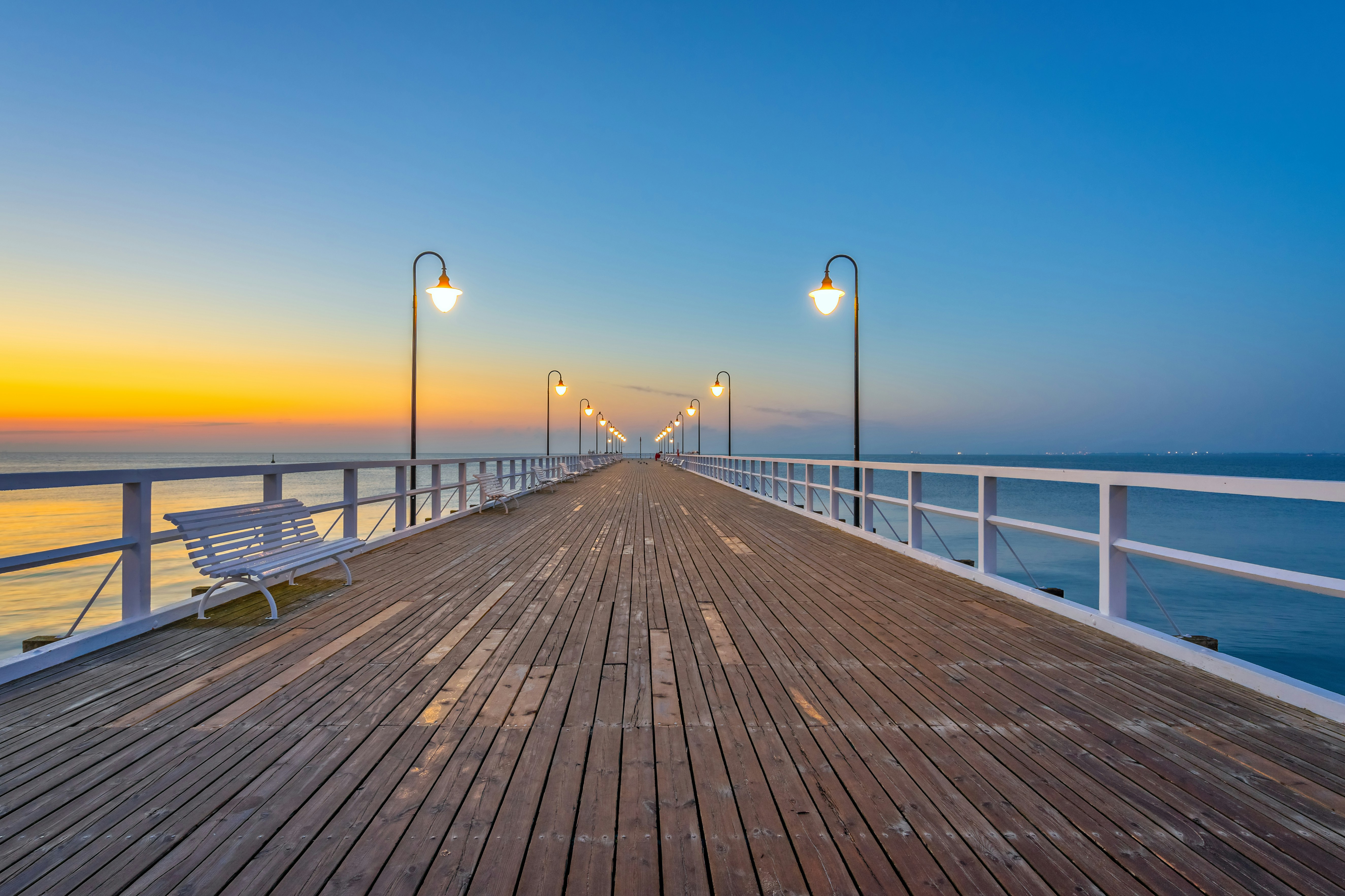 Sunlit Pier to the Horizon