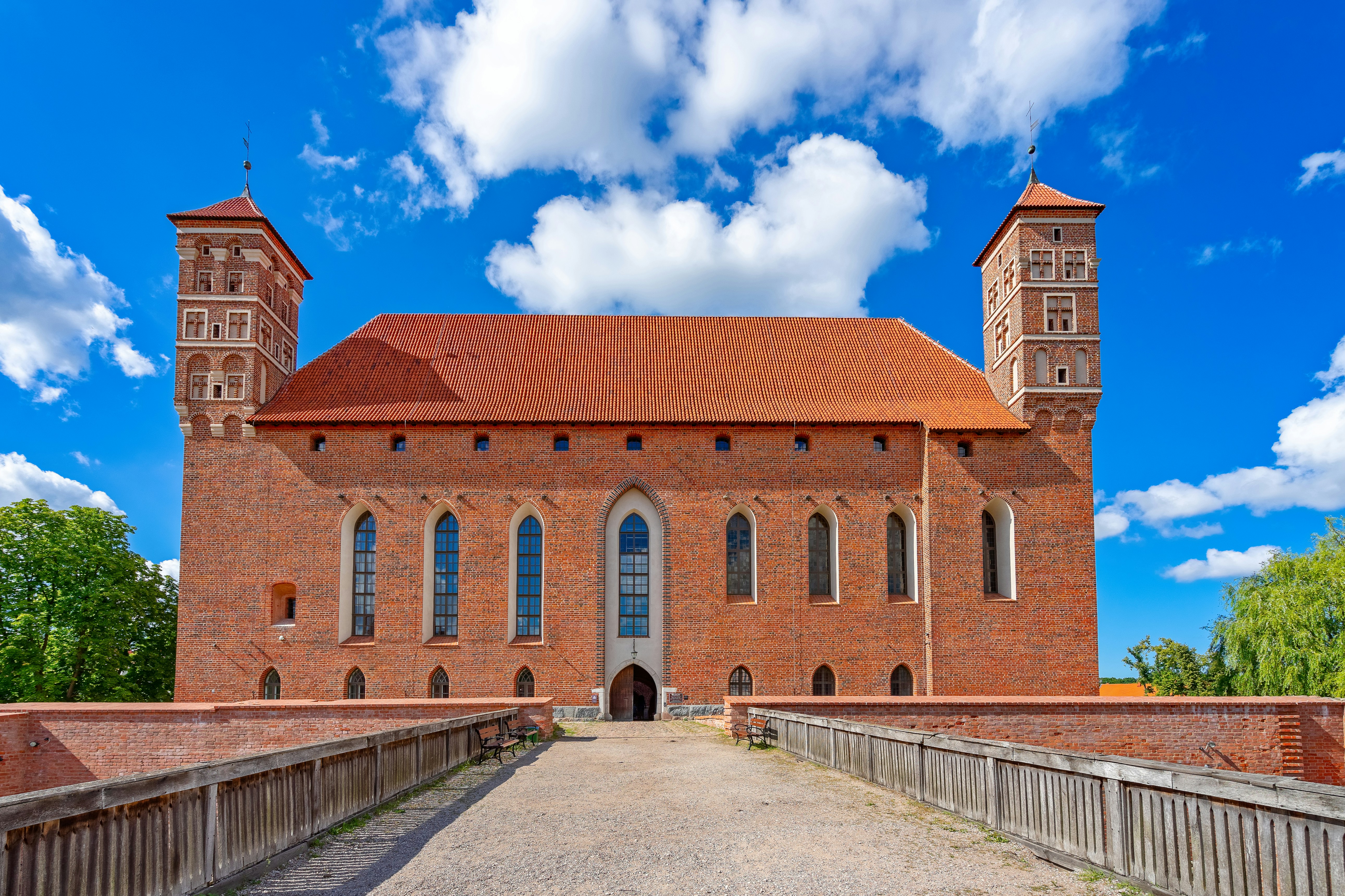 Brick Fortress Rise: Twin Towers Guard a Gabled Hall