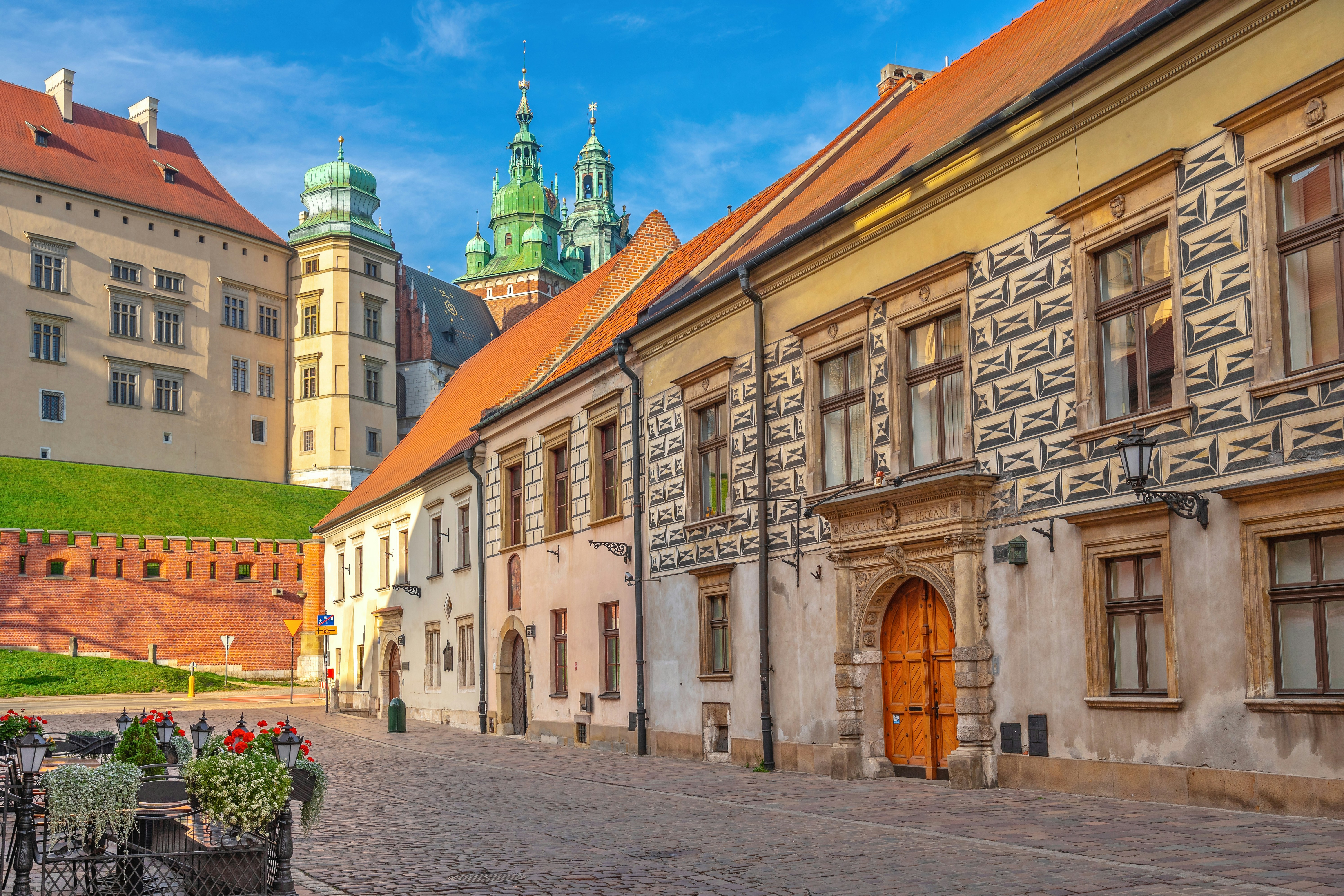 Sunlit Stairs and Timbered Facades along a Polish Castle Quarter