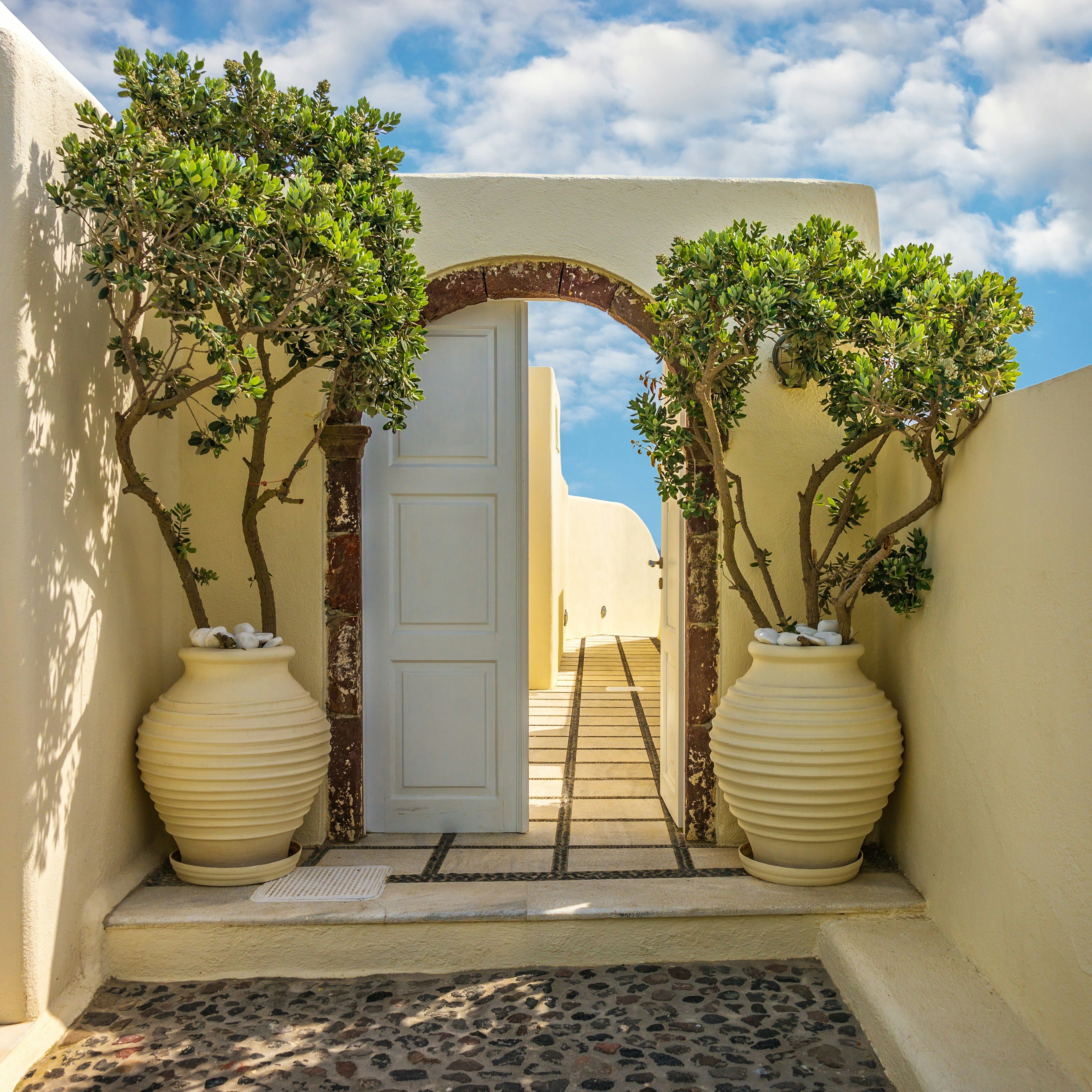 Open Archway to Sunlit Courtyard: Mediterranean Entry