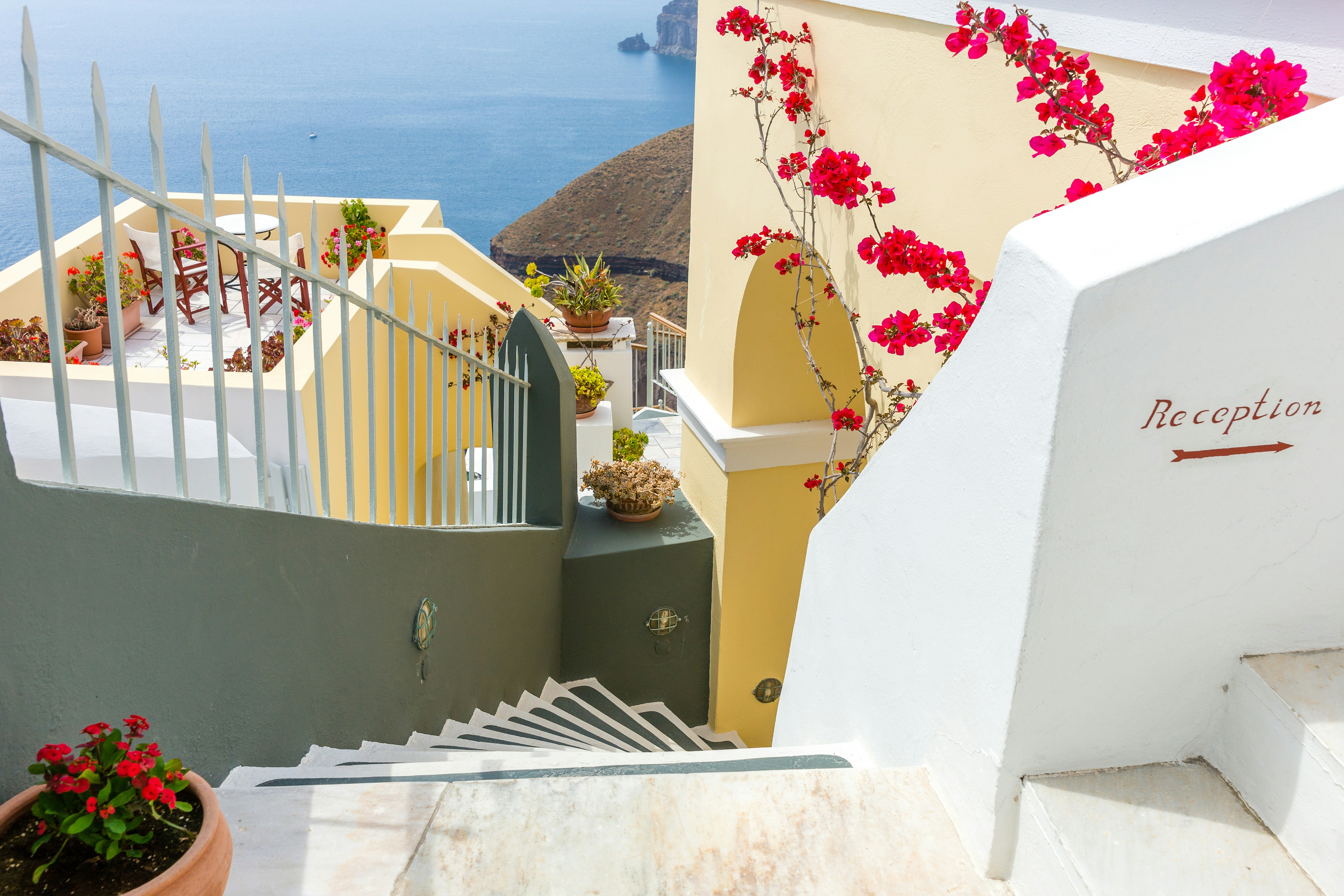 Terraced Staircase toward the Aegean: Bougainvillea, Sea, and Sunlit Steps