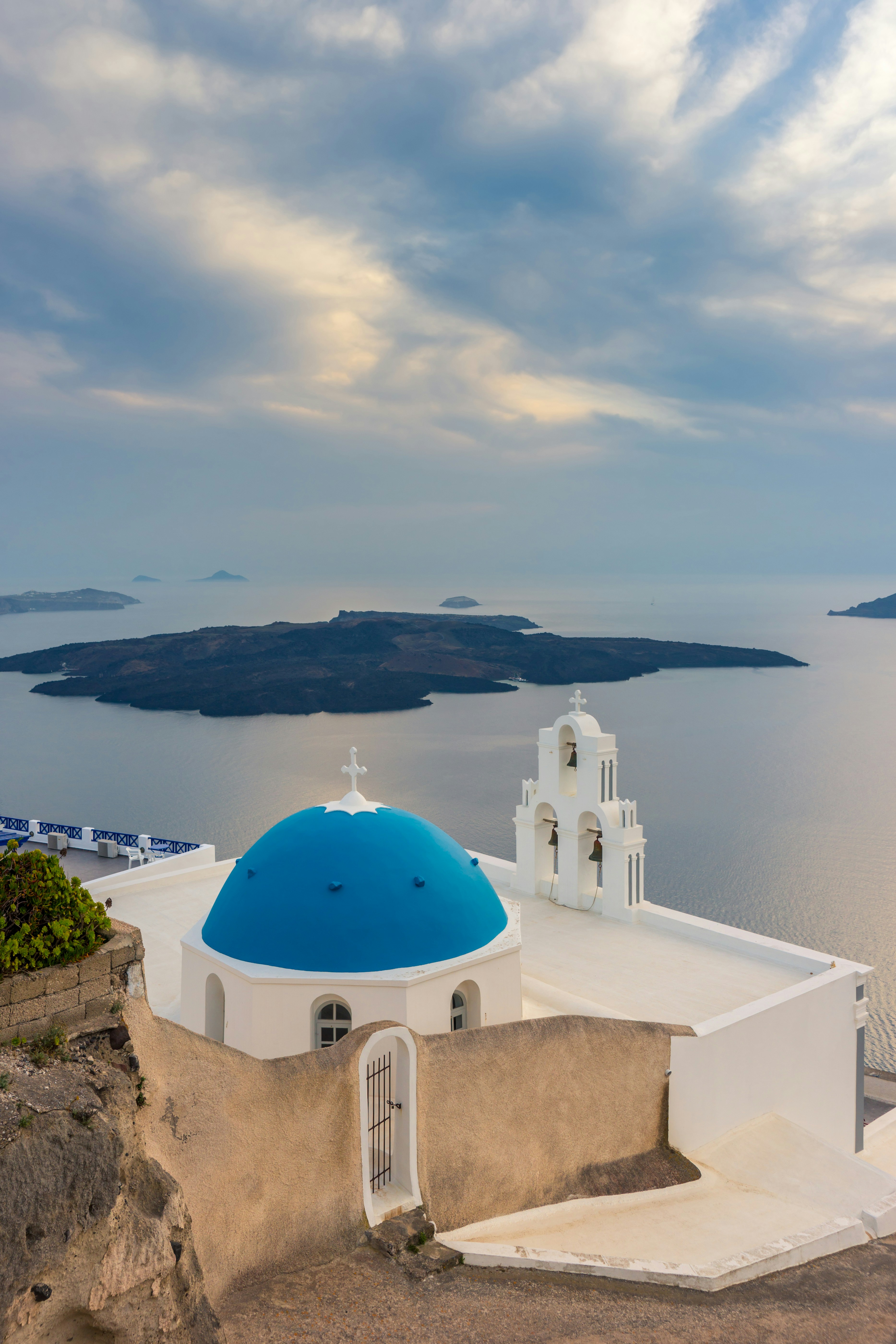 Blue Dome and Sea Silhouettes: A Santorini Terrace at Dusk