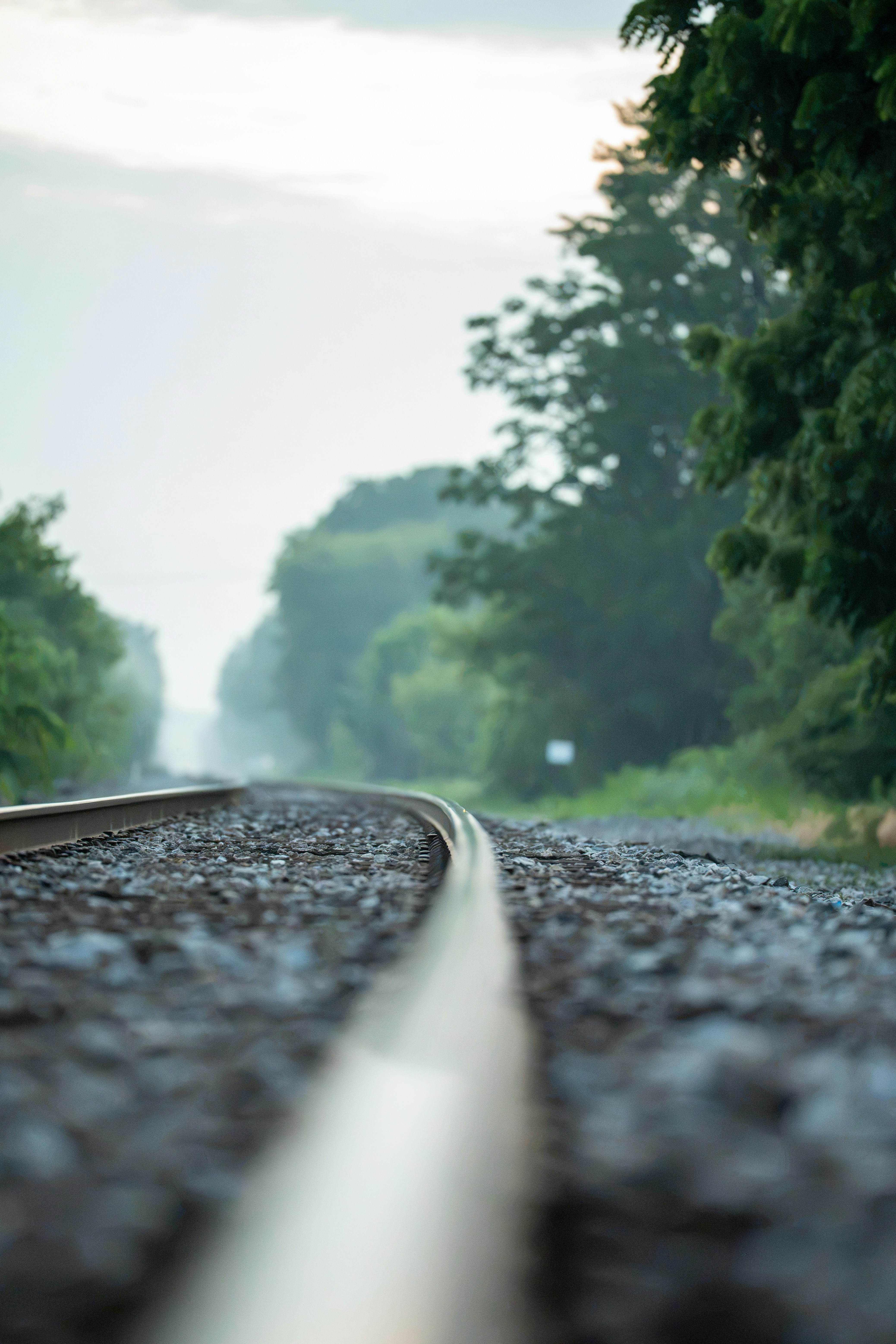 A close-up of train tracks going off into the distance