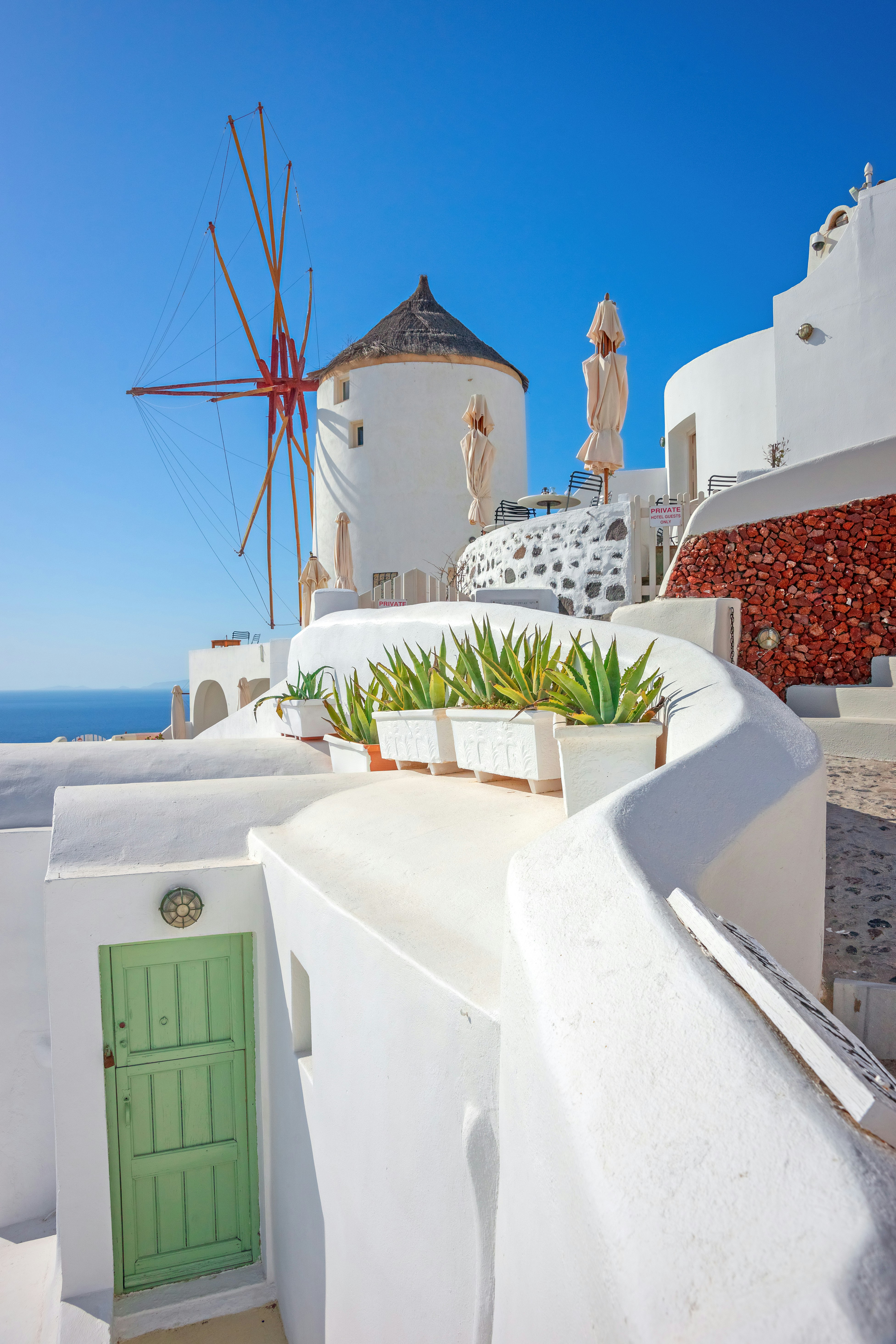 Blue Sky, White Steps: Windmills and a Sea Horizon