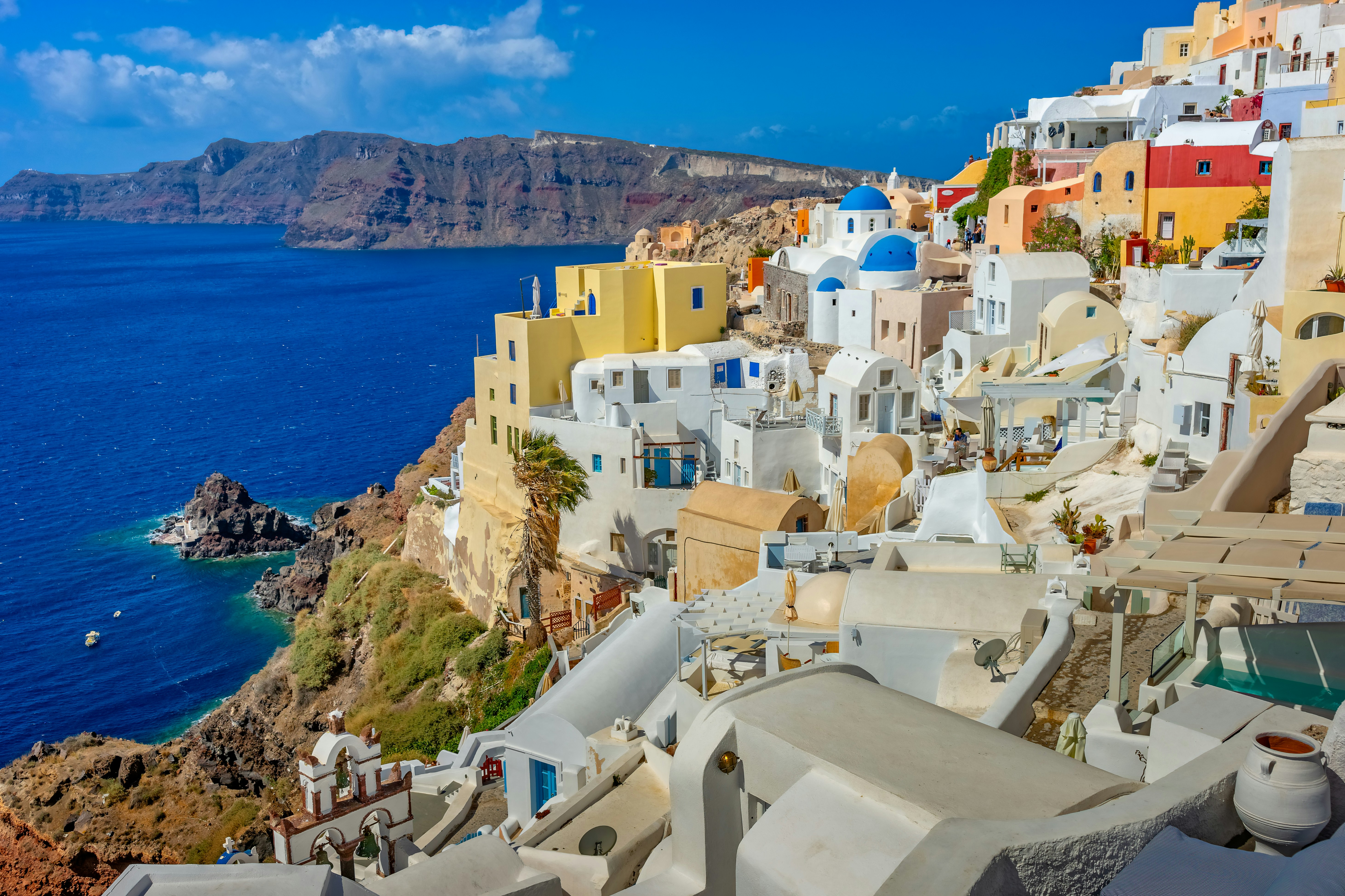 White-washed Cyclades: Sunlit Cliffs and Blue Domes Over the Aegean