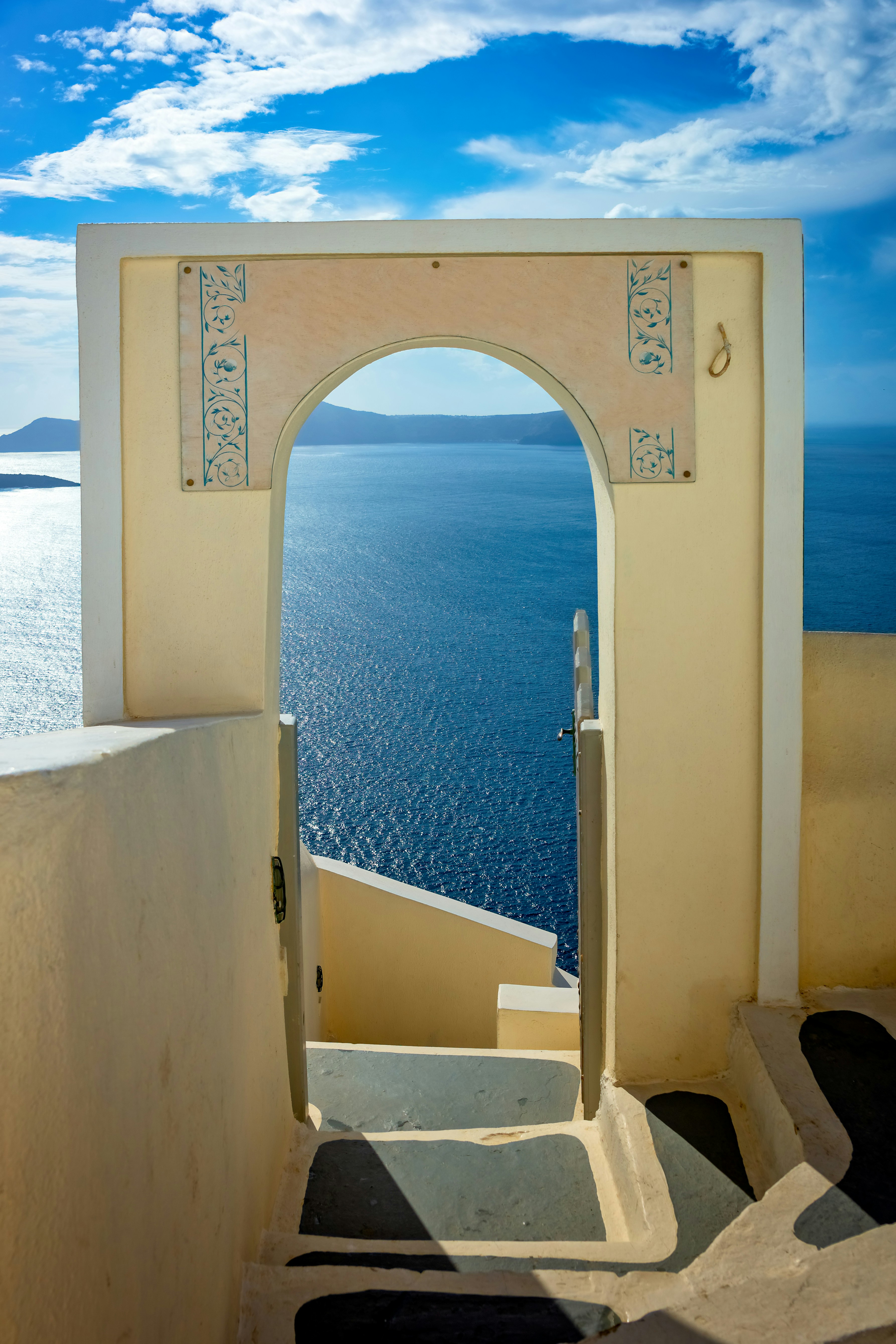 Gateway to the Aegean: Sunlit Arch Framing Ocean Vista