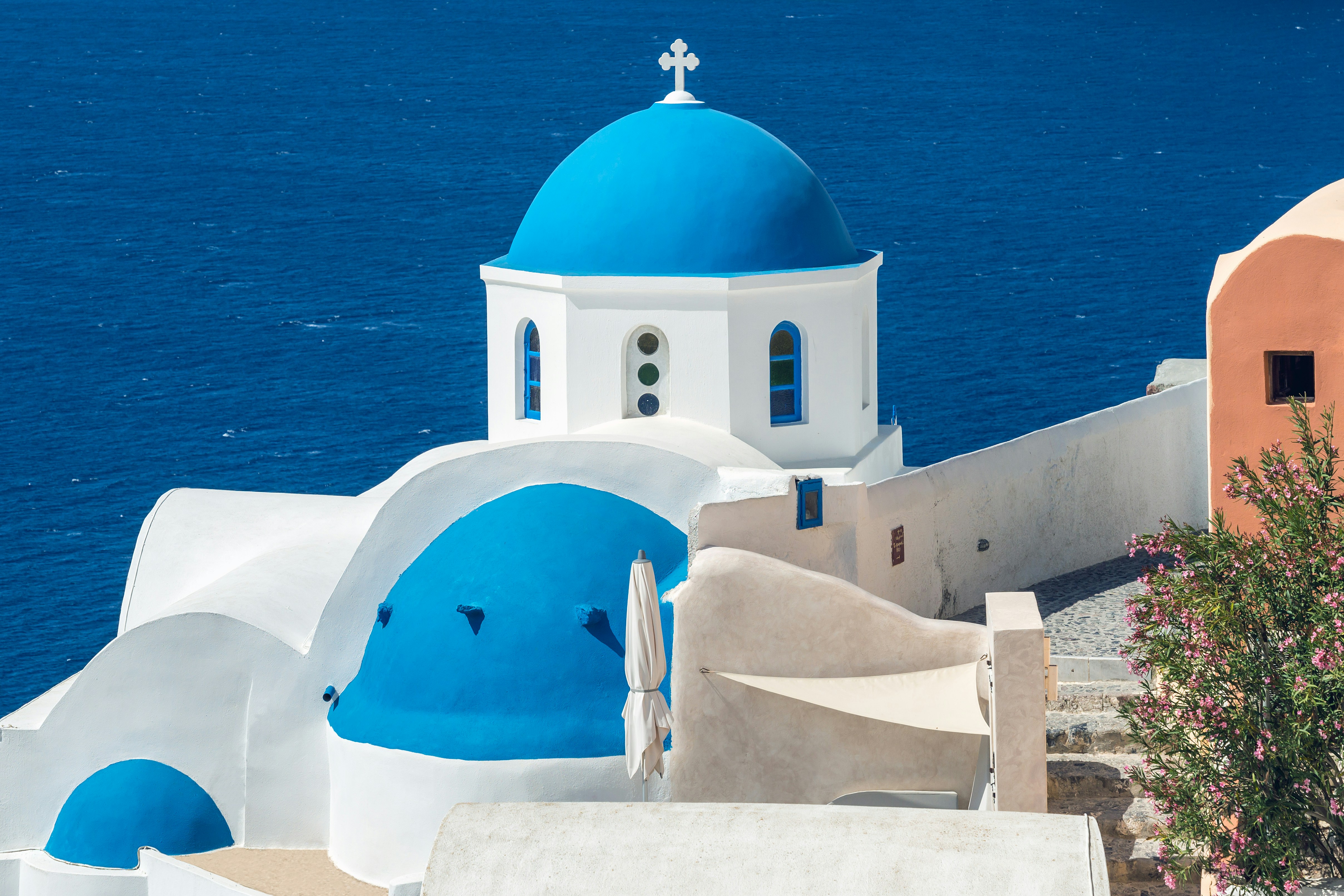 Azure Domes Over Aegean Whitewash