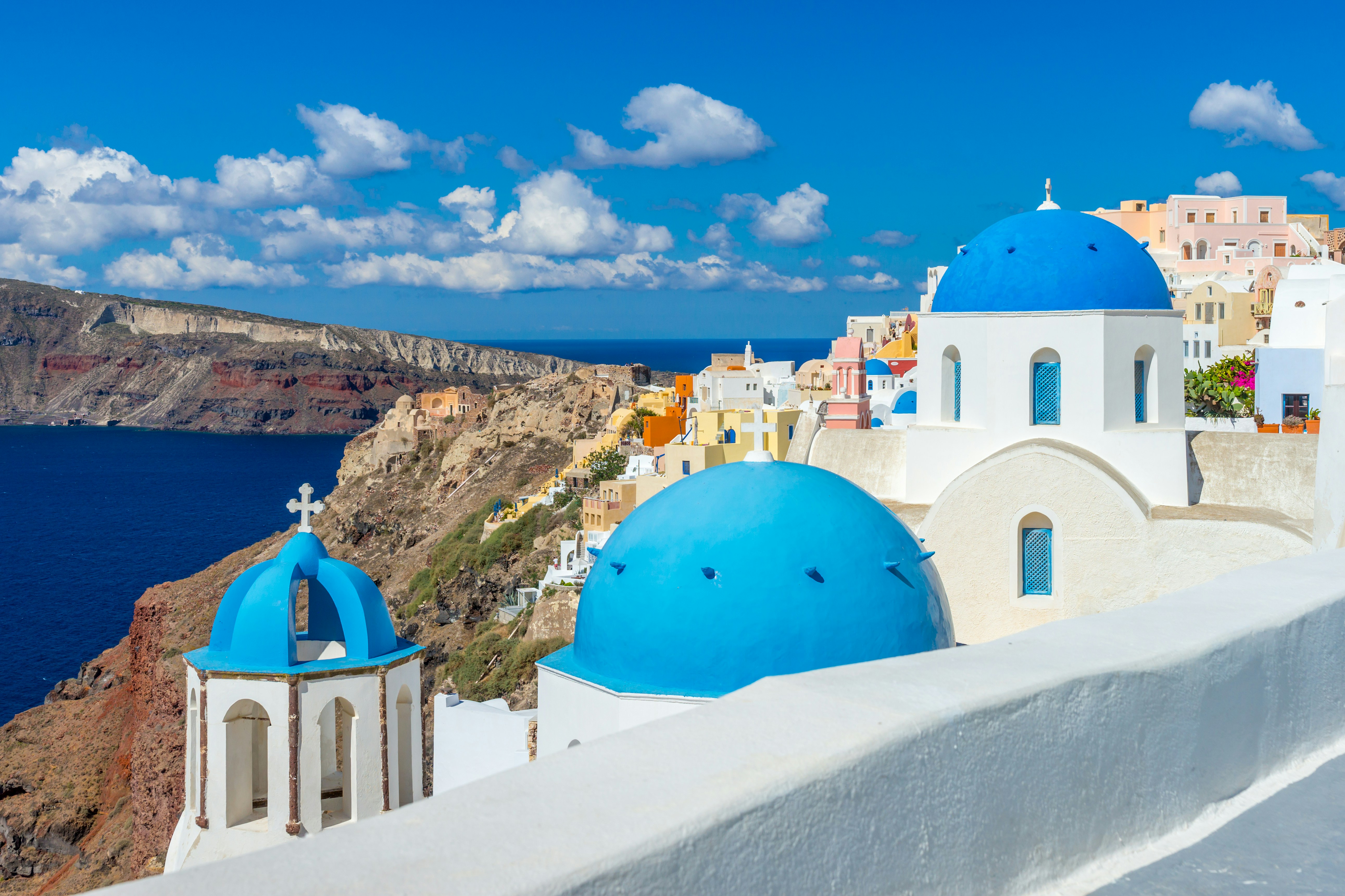 Blue Domes Over the Aegean: Santorini's Sunlit Silhouette